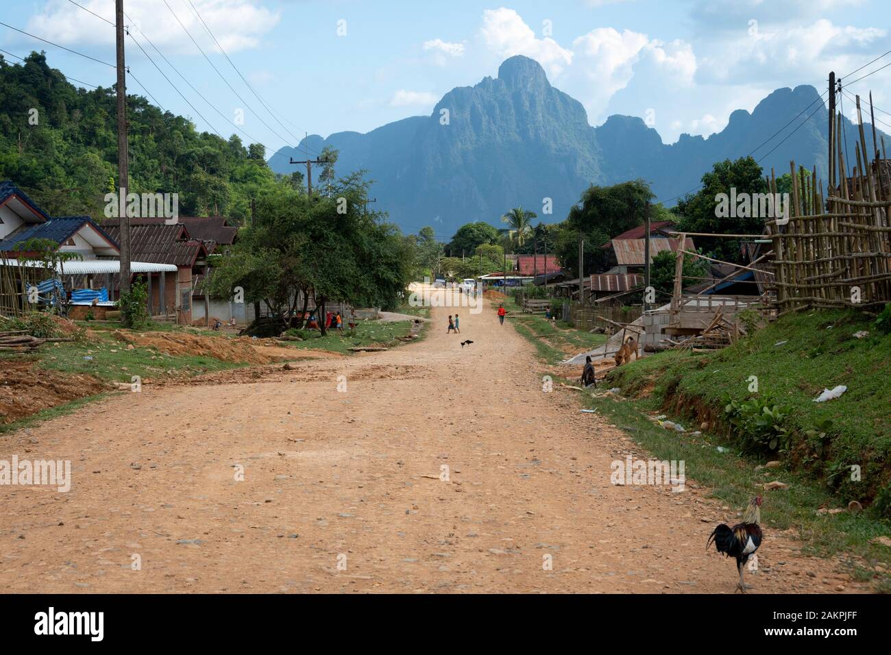 Road through village near Vang Vieng, Laos Stock Photo - Alamy