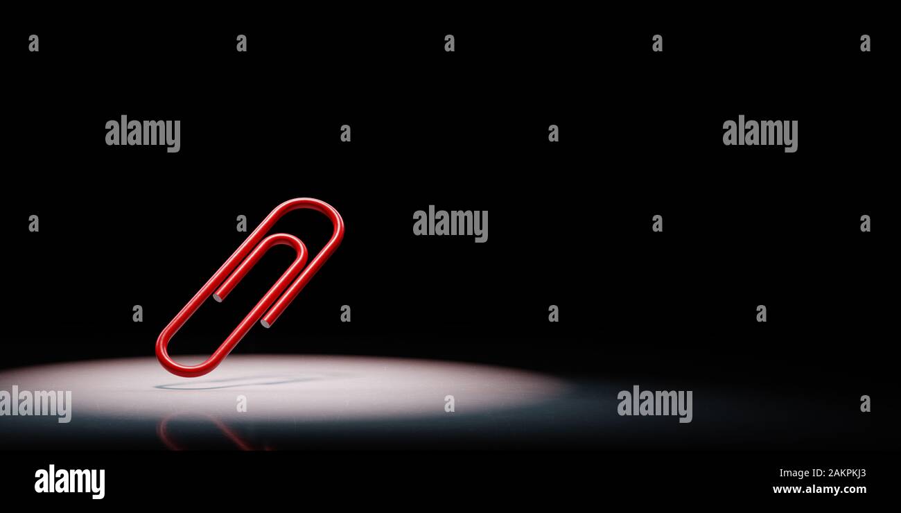 One Red Paperclip Spotlighted on Black Background Stock Photo - Alamy