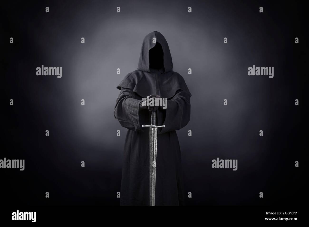 Ghostly figure with medieval sword in the dark Stock Photo - Alamy
