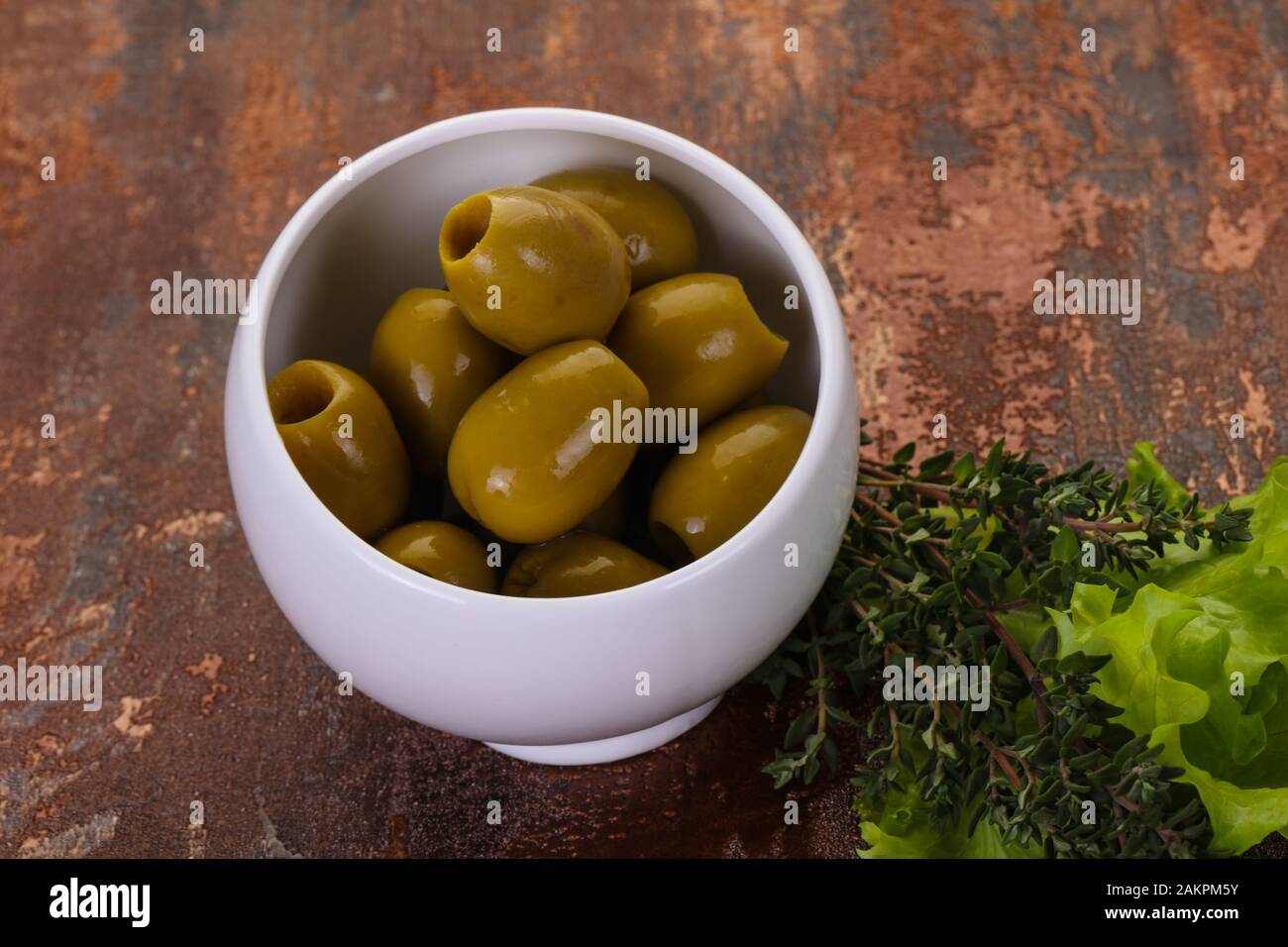 Big green olives in the bowl Stock Photo - Alamy