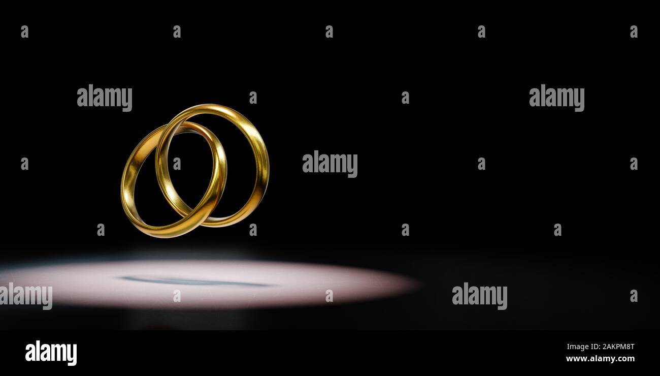 Two Golden Rings Chained Spotlighted on Black Background 3D ...