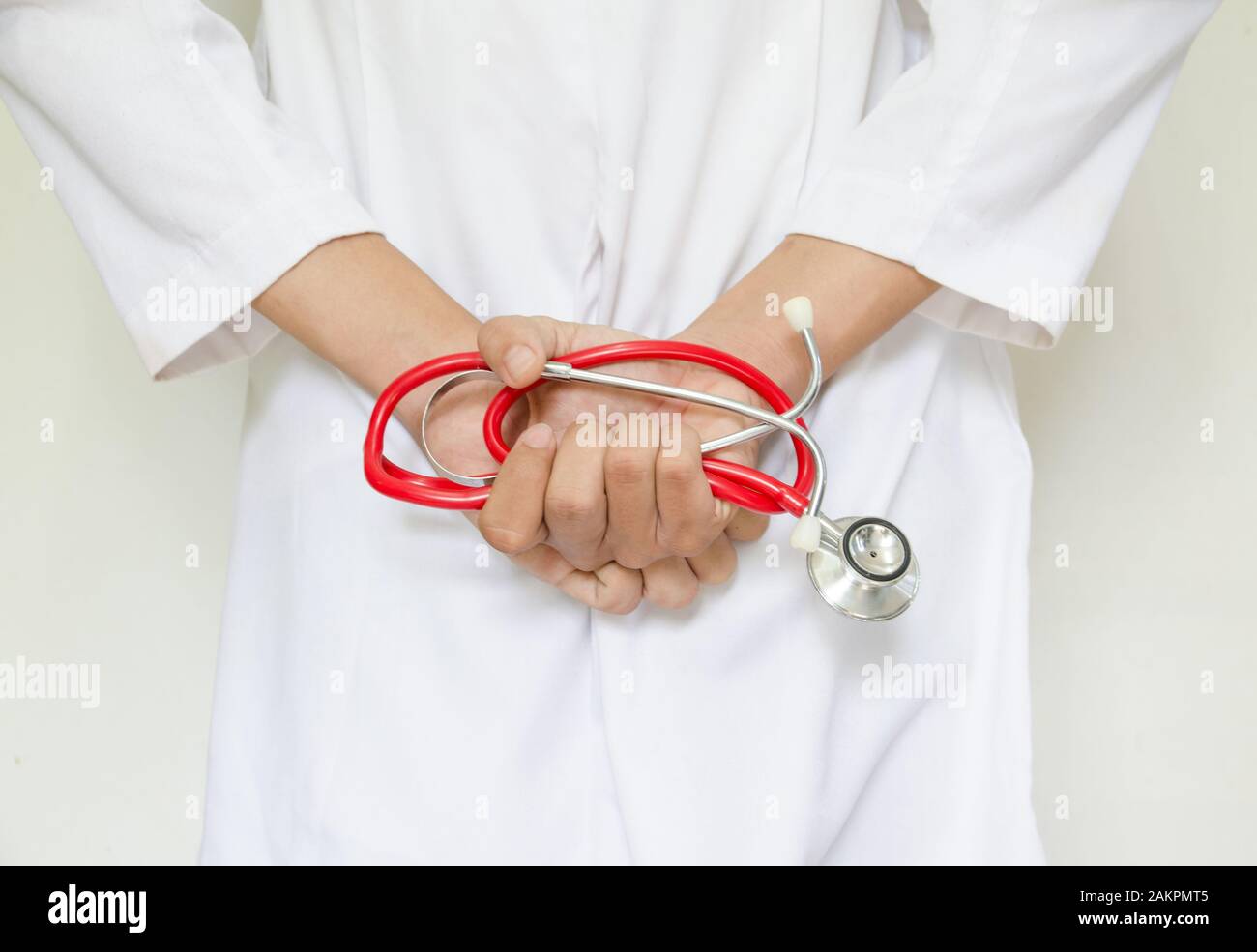 doctor holding stethoscope on back Stock Photo - Alamy