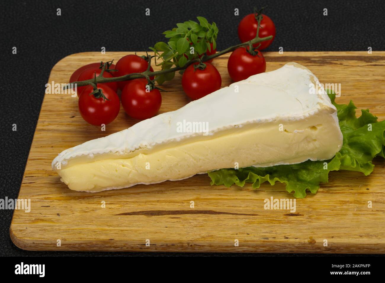 Brie cheese triangle served salad leaves Stock Photo - Alamy