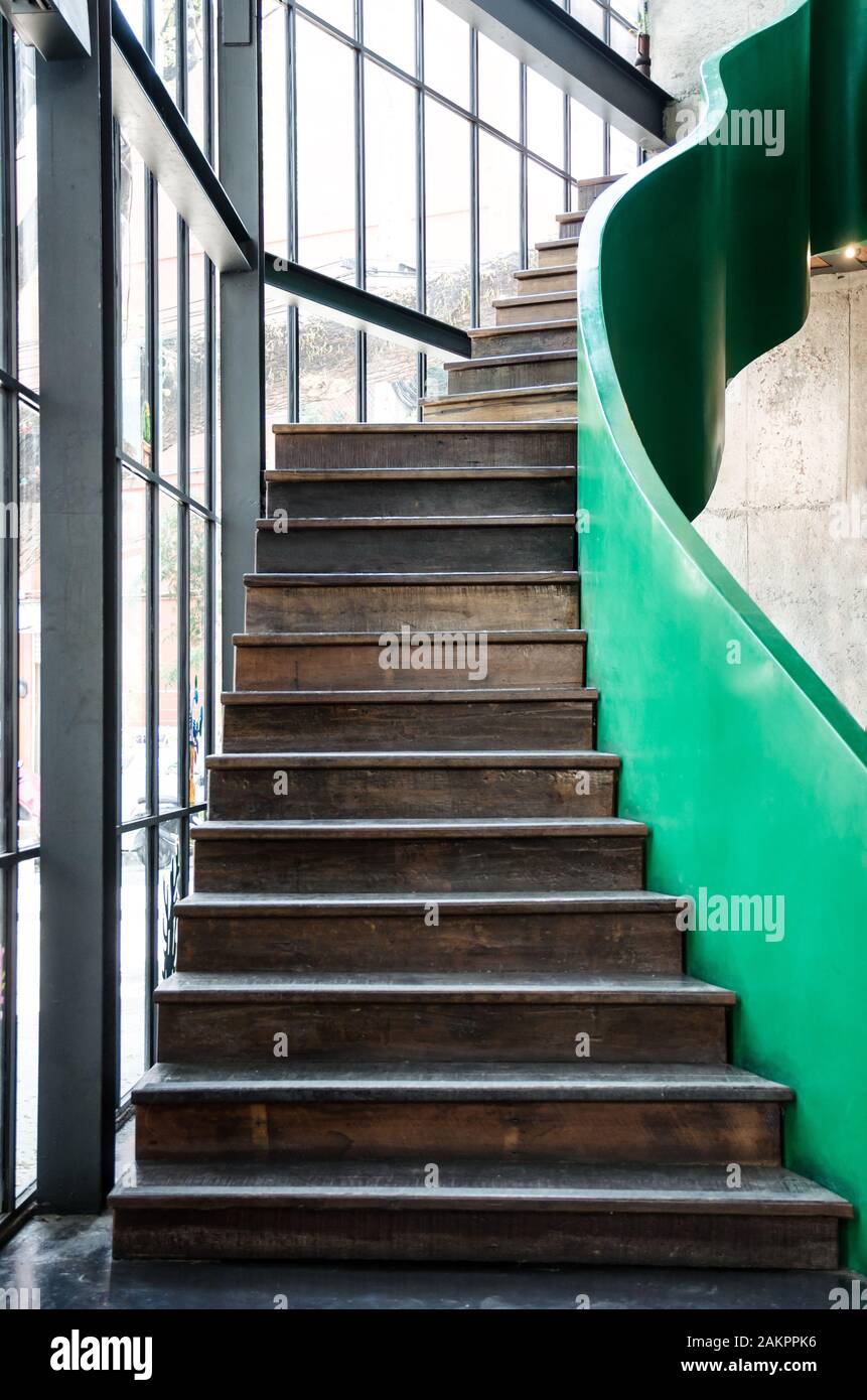 wooden stair with green handrail and glass window Stock Photo - Alamy
