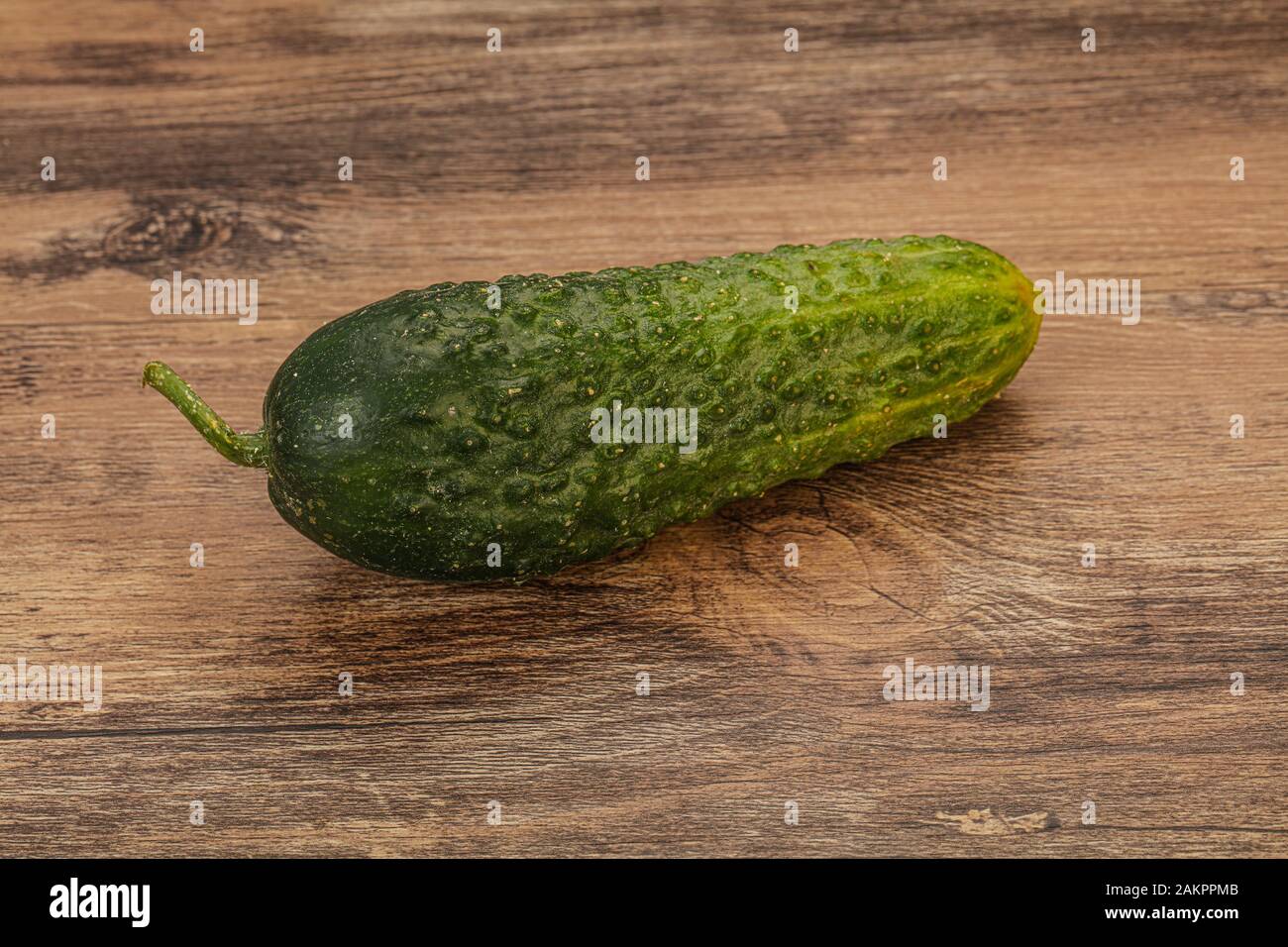 Green ripe fresh one cucumber over background Stock Photo - Alamy