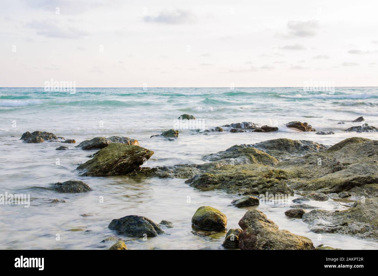 stone on beach with sea Stock Photo - Alamy