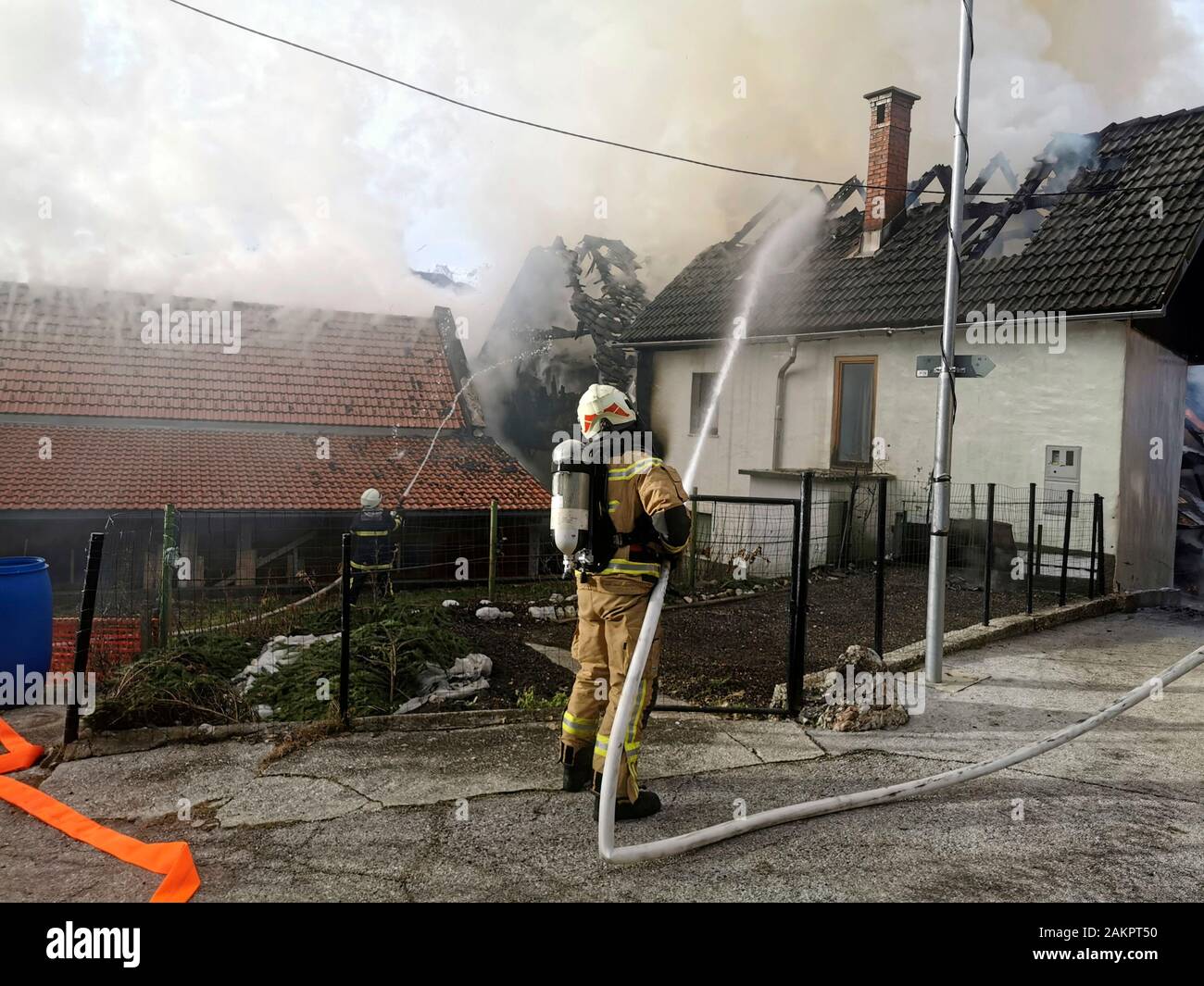 firemen fighting a fire in wood house Stock Photo - Alamy