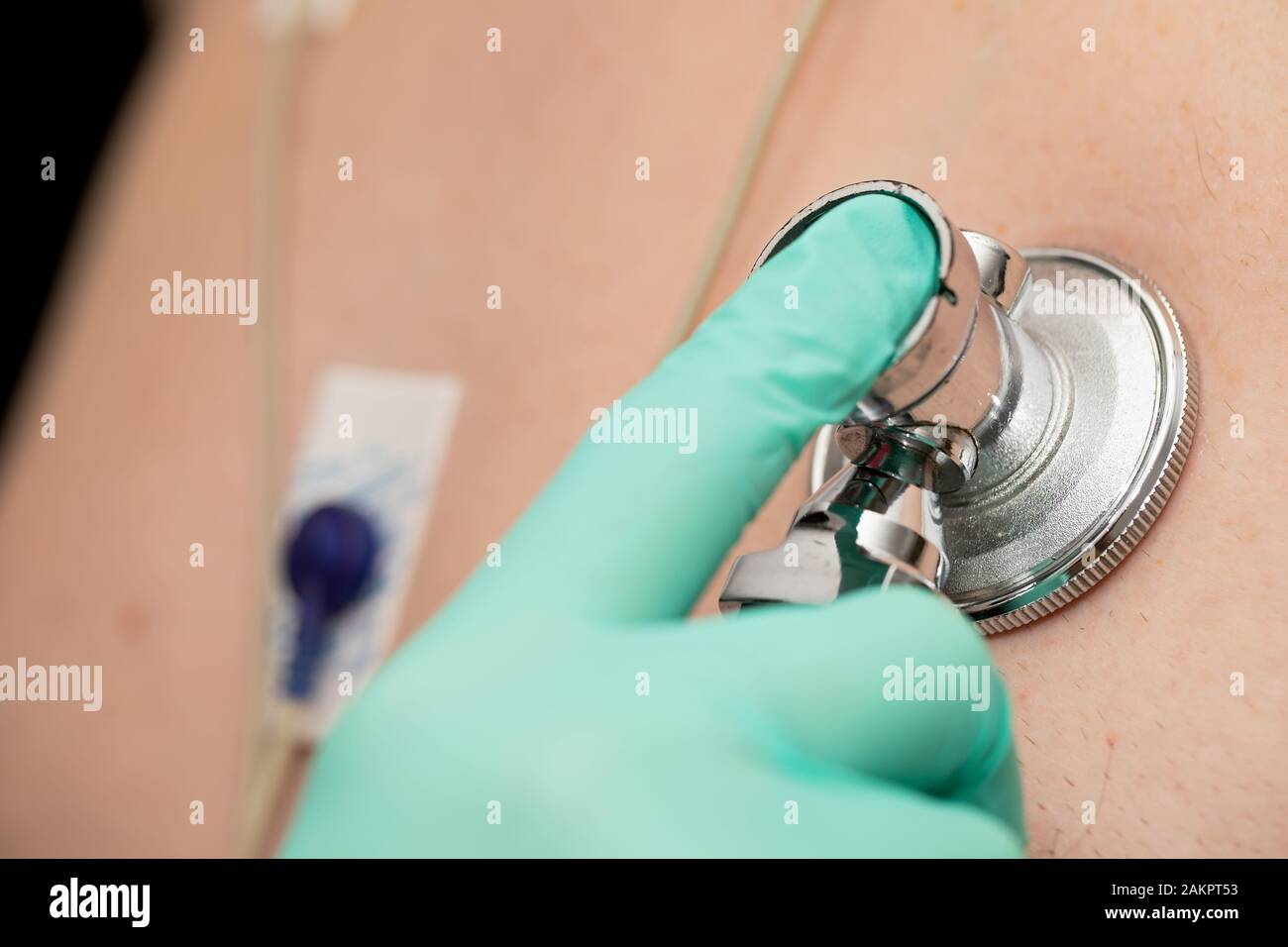 Young man with heart diseases wearing holter monitor device for an ...
