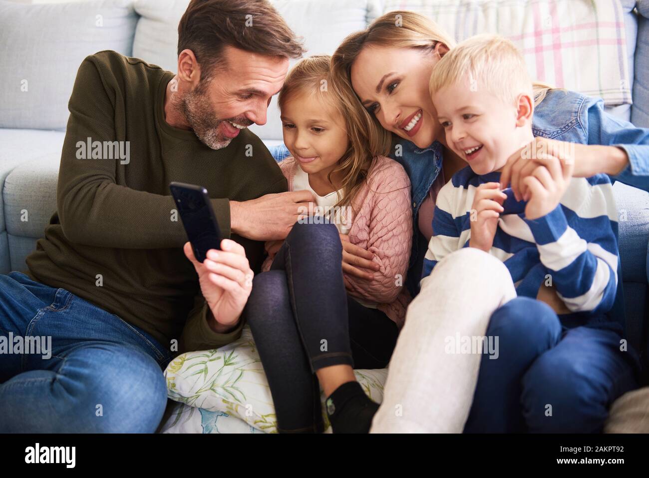Family modern interior phone hi-res stock photography and images - Alamy