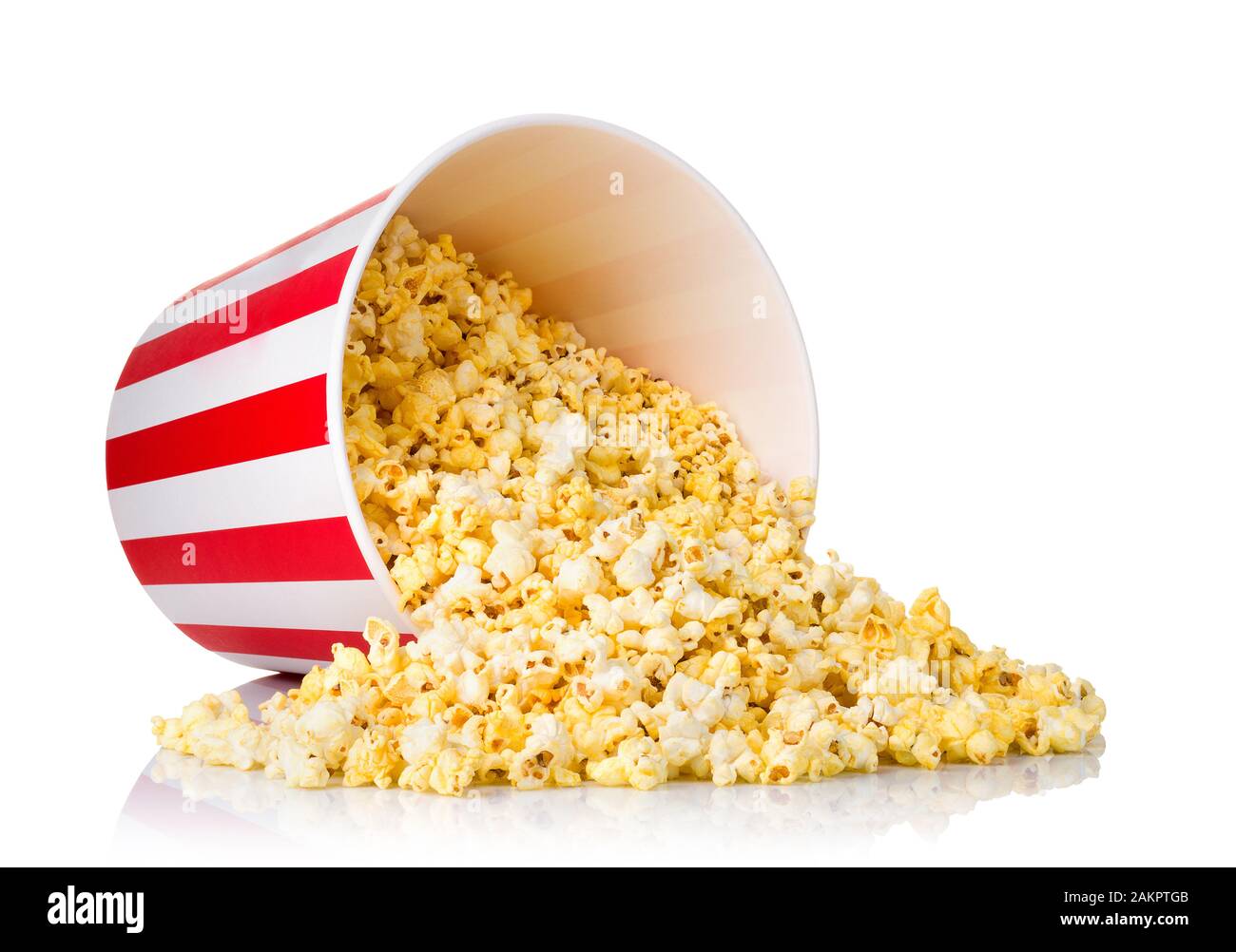 Scattered popcorn from paper striped bucket isolated on white ...