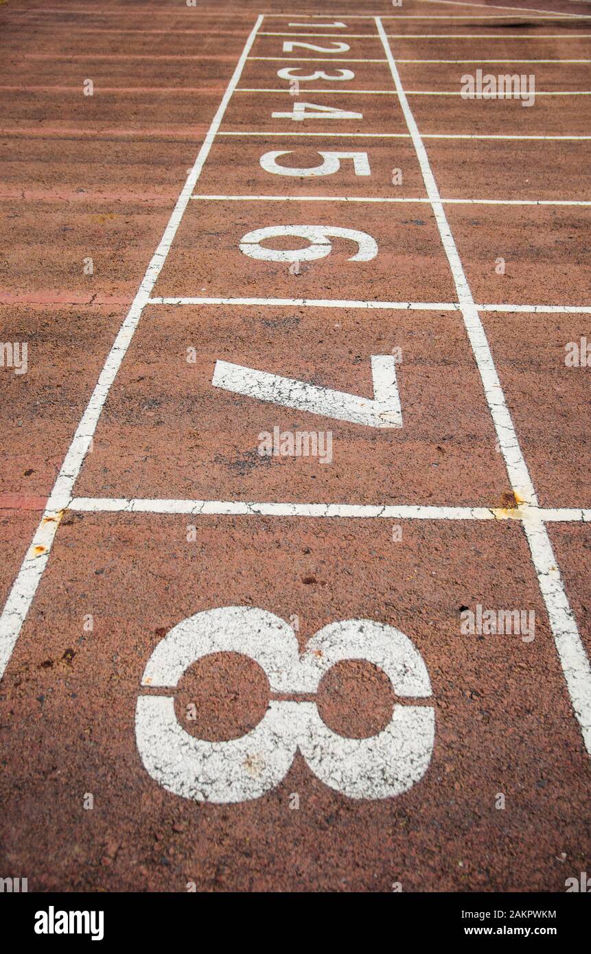 pale red running track with number Stock Photo - Alamy