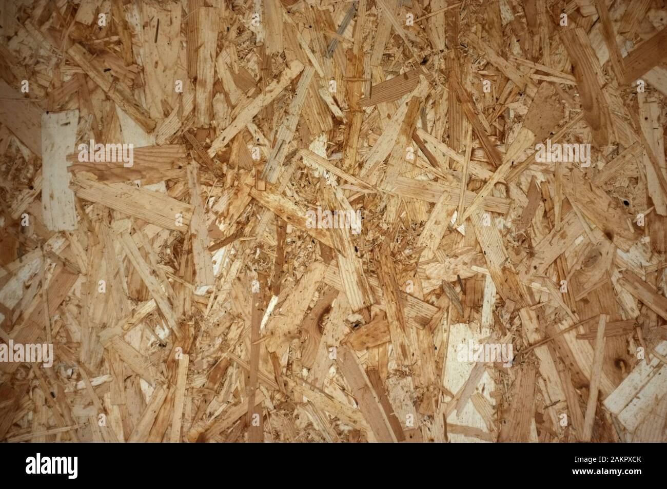 OSB Boards are made of brown wood chips sanded into a wooden background ...