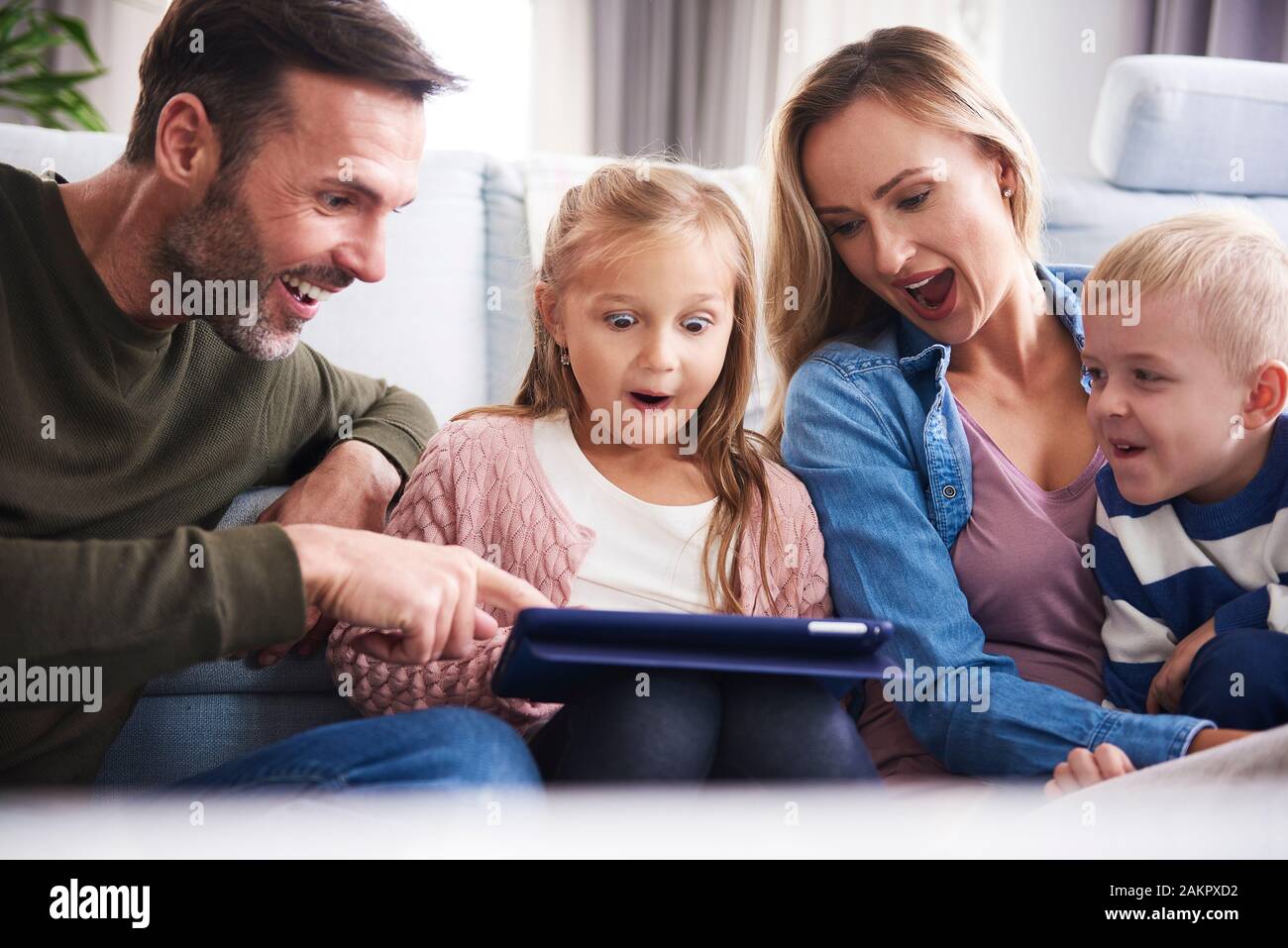 Daughter show her tablet computer hi-res stock photography and images ...