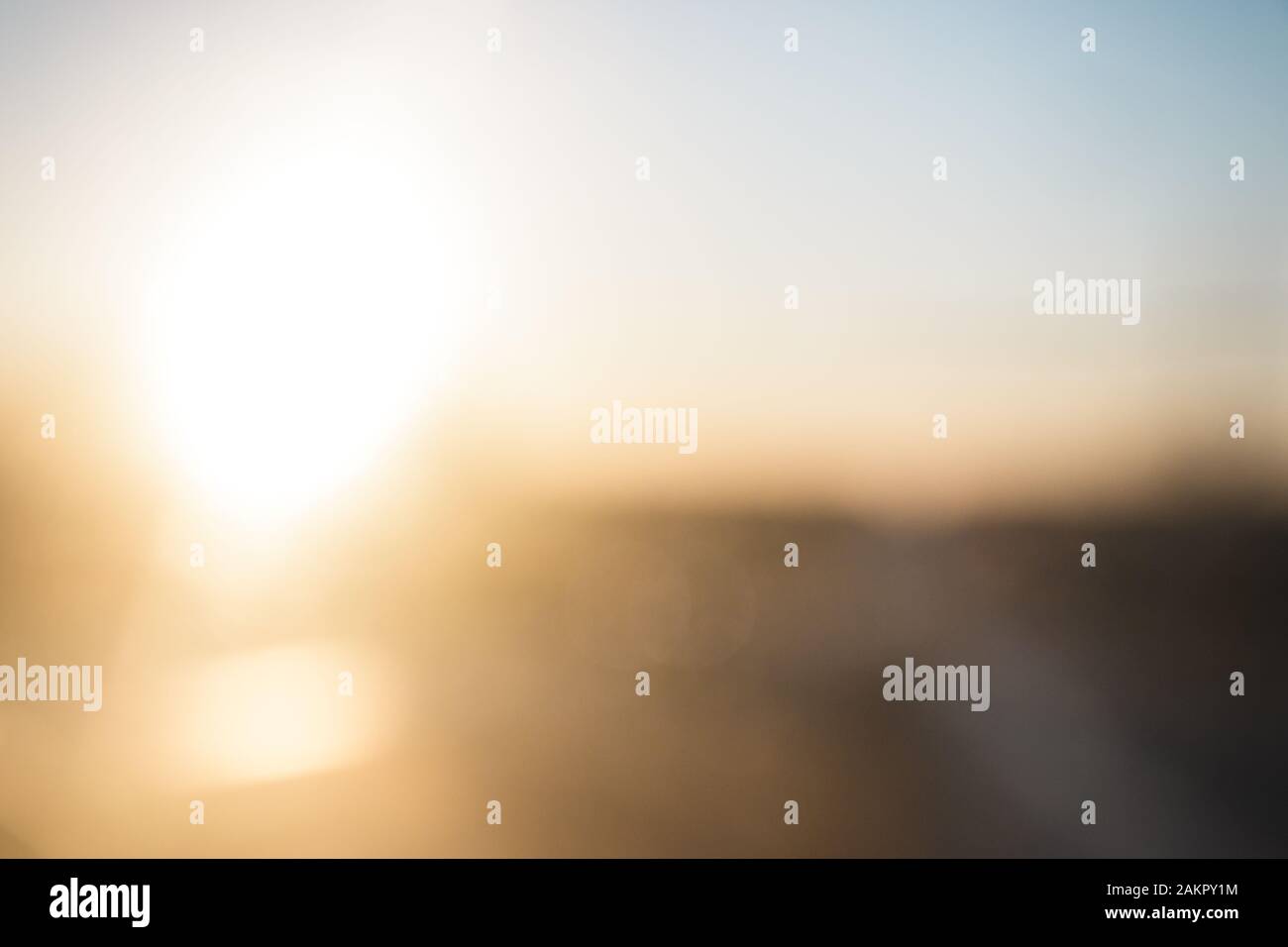 sun light and abstract blurry sunrise background Stock Photo - Alamy