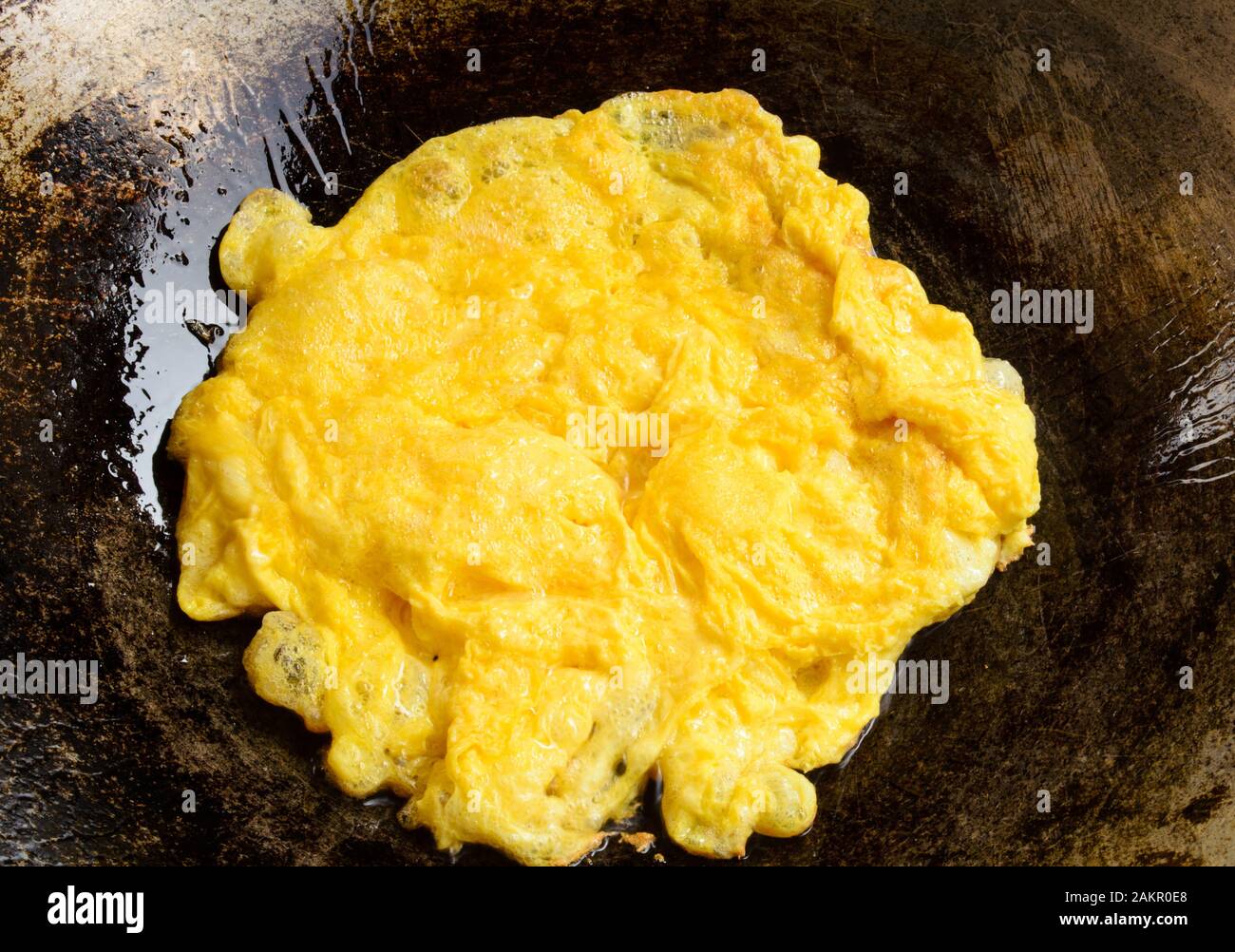 yellow omelette cooking on pan Stock Photo - Alamy