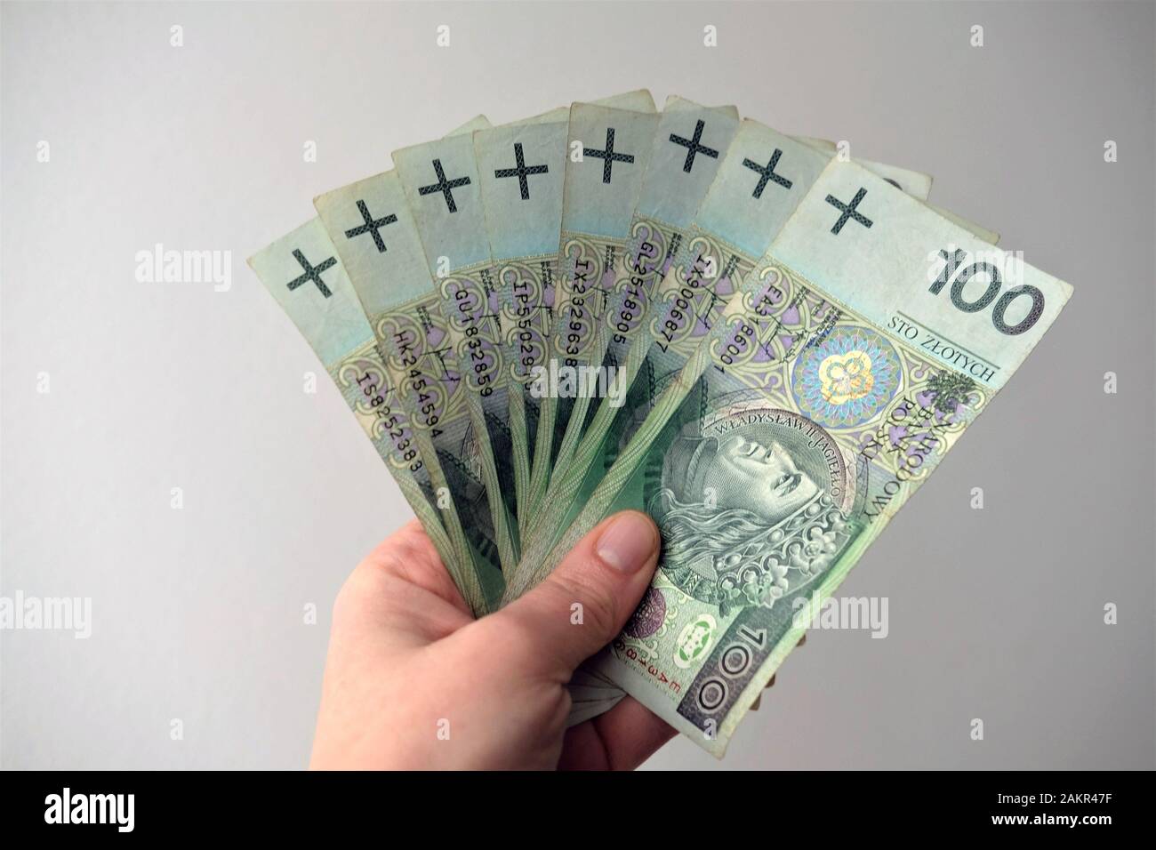 range of one hundred polish zloty notes held in hand Stock Photo - Alamy