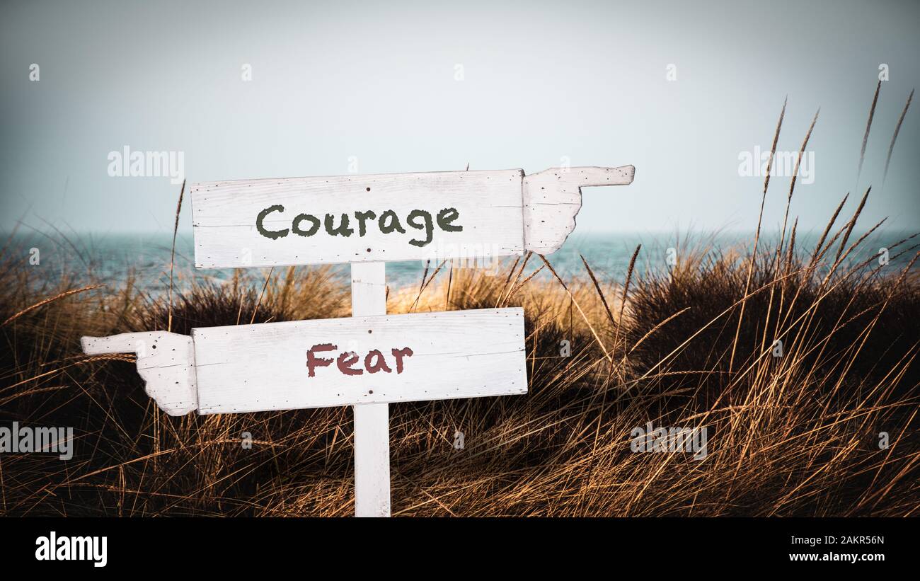 Street Sign the Direction Way to Courage versus Fear Stock Photo - Alamy