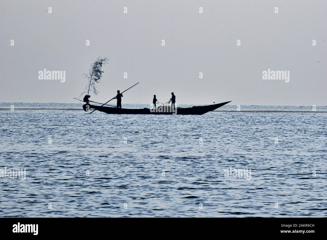 fishermen fishing on a boat Stock Photo - Alamy