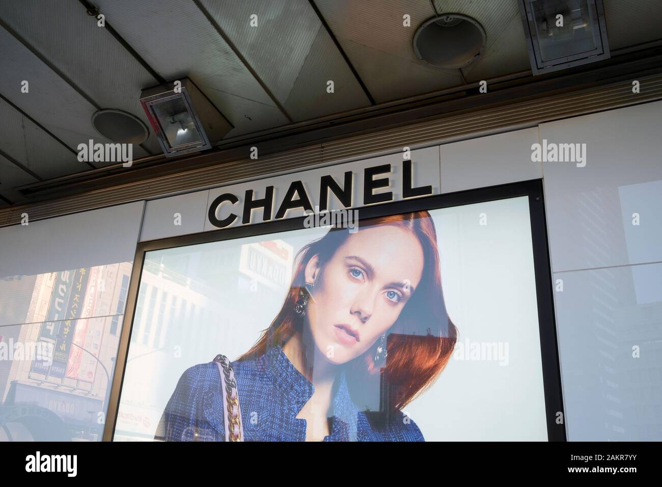Chanel brand adverstising billboard in a store window in Tokyo Japan ...