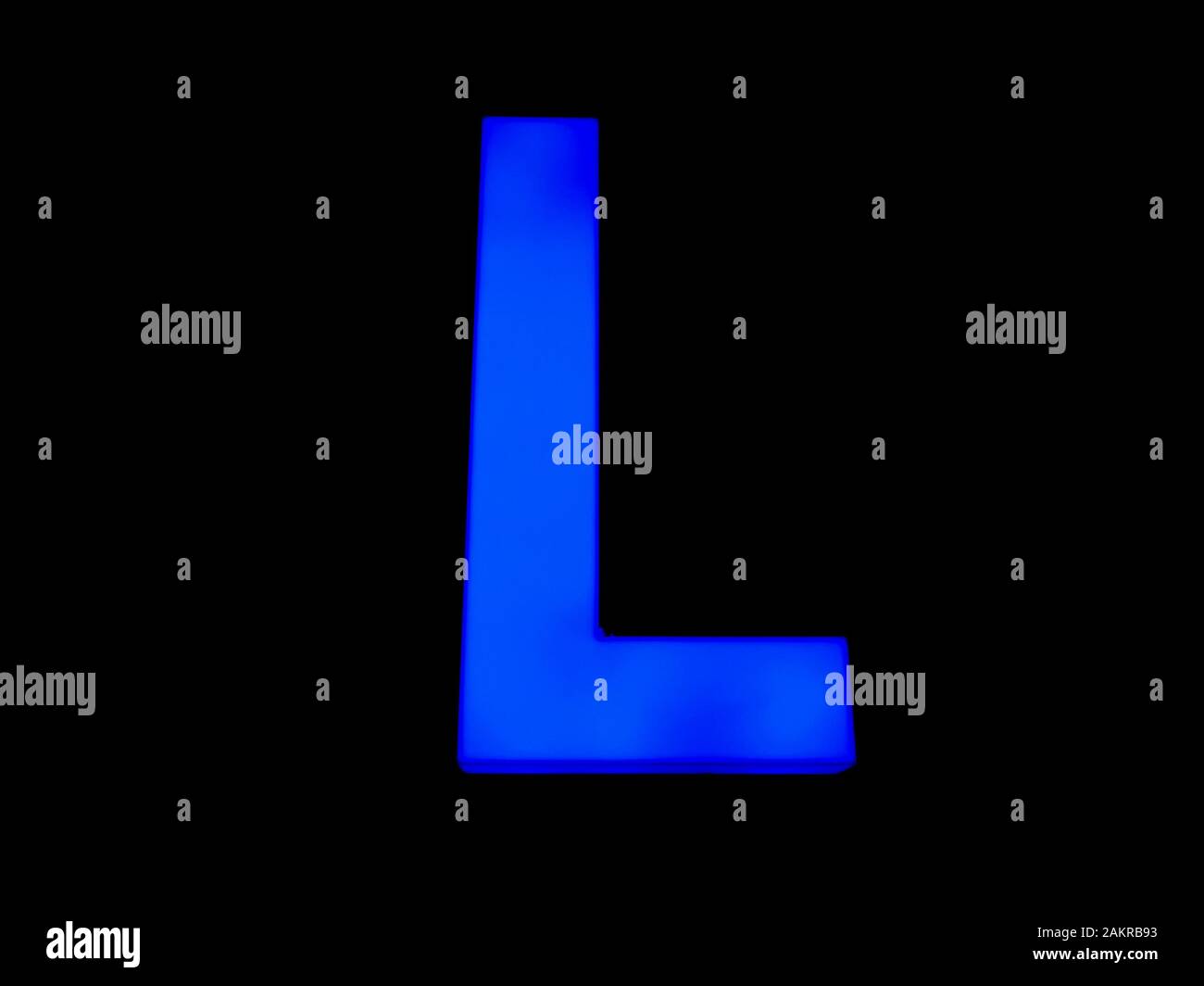 Blue neon light capital letter L over black background Stock Photo - Alamy
