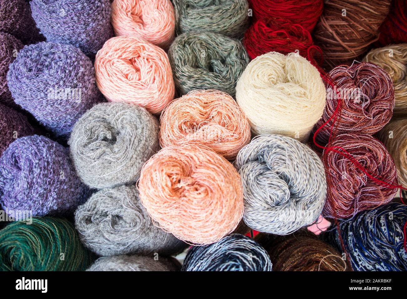 Multi-colored woolen threads in a wooden box for sale Stock Photo - Alamy