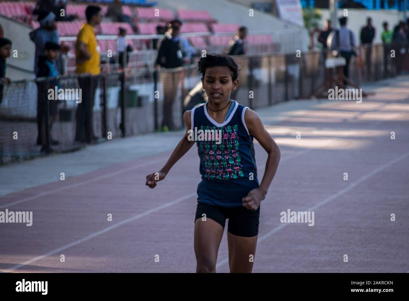 Girls running in 100 meter race compition Stock Photo - Alamy