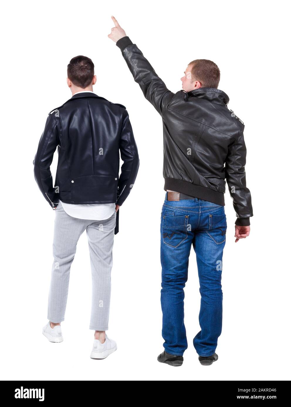 Back view of couple couple in winter jackets pointing. beautiful ...