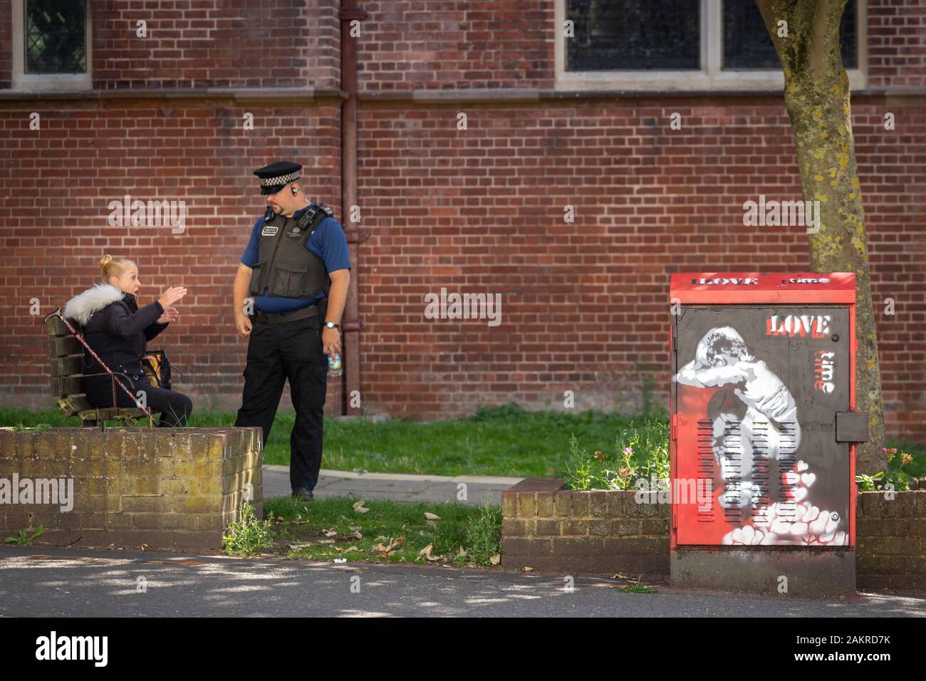 copper having a word with a lady Stock Photo - Alamy