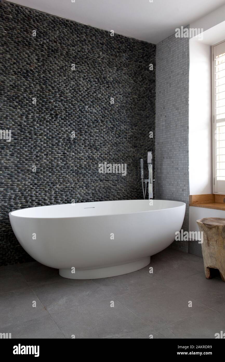 bathroom with pebble wall Stock Photo - Alamy
