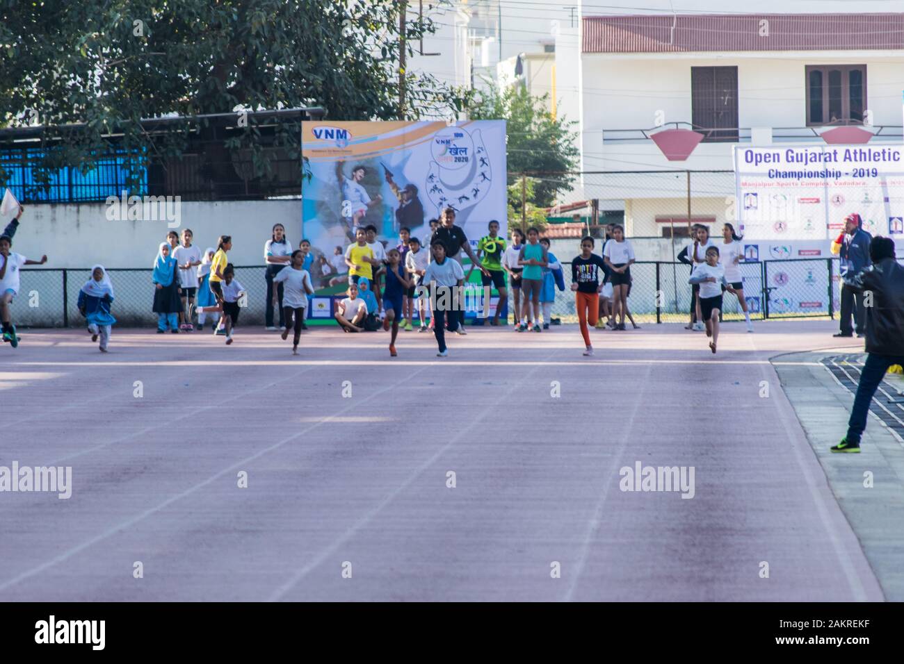 Girls running in 100 meter race compition Stock Photo - Alamy