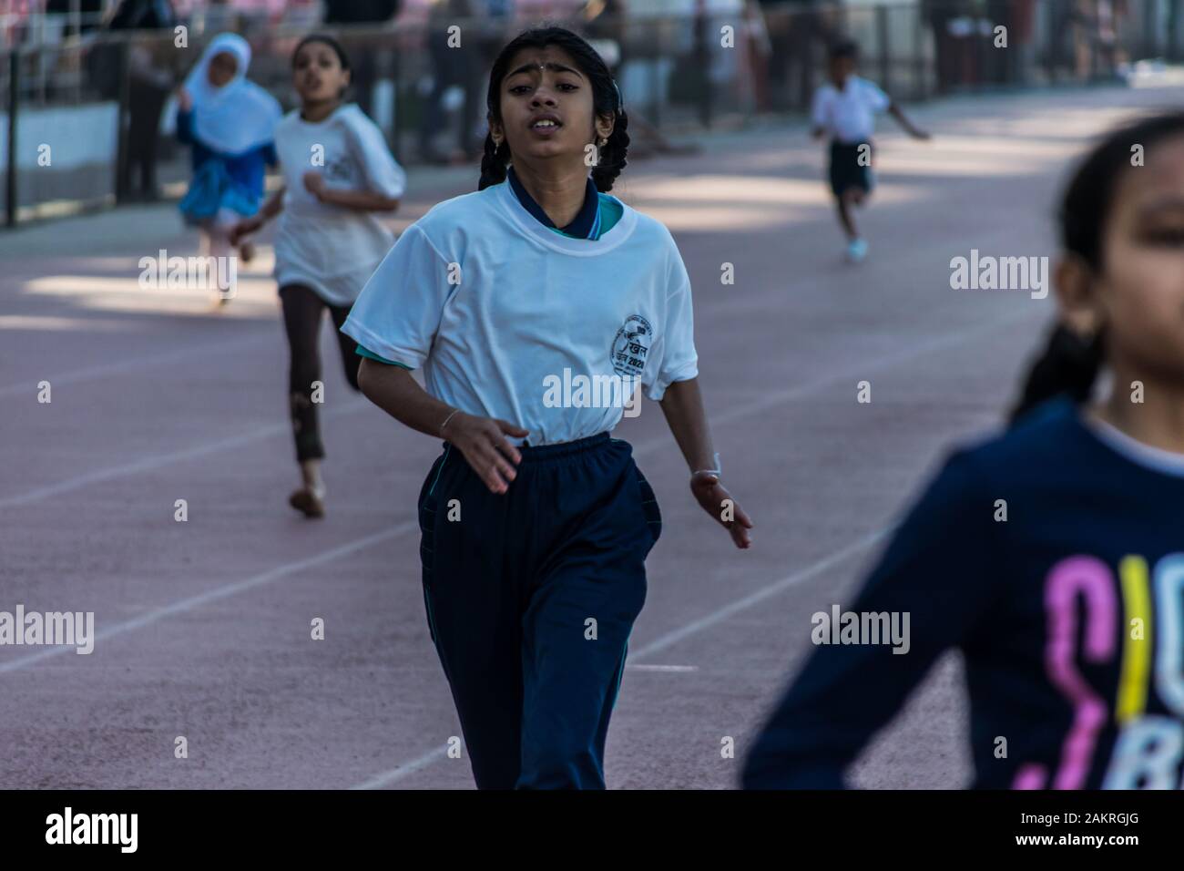 Girls running in 100 meter race compition Stock Photo - Alamy