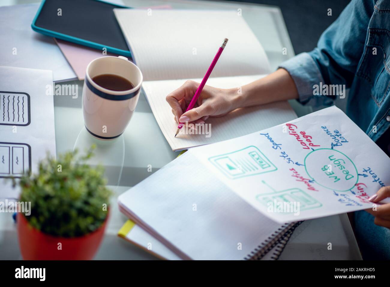 Top view of notes being taken in the notebook Stock Photo - Alamy