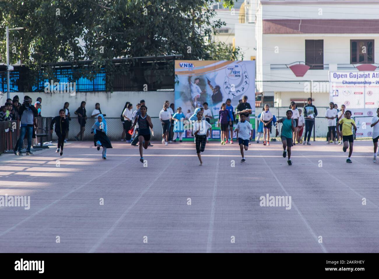 Girls running in 100 meter race compition Stock Photo - Alamy