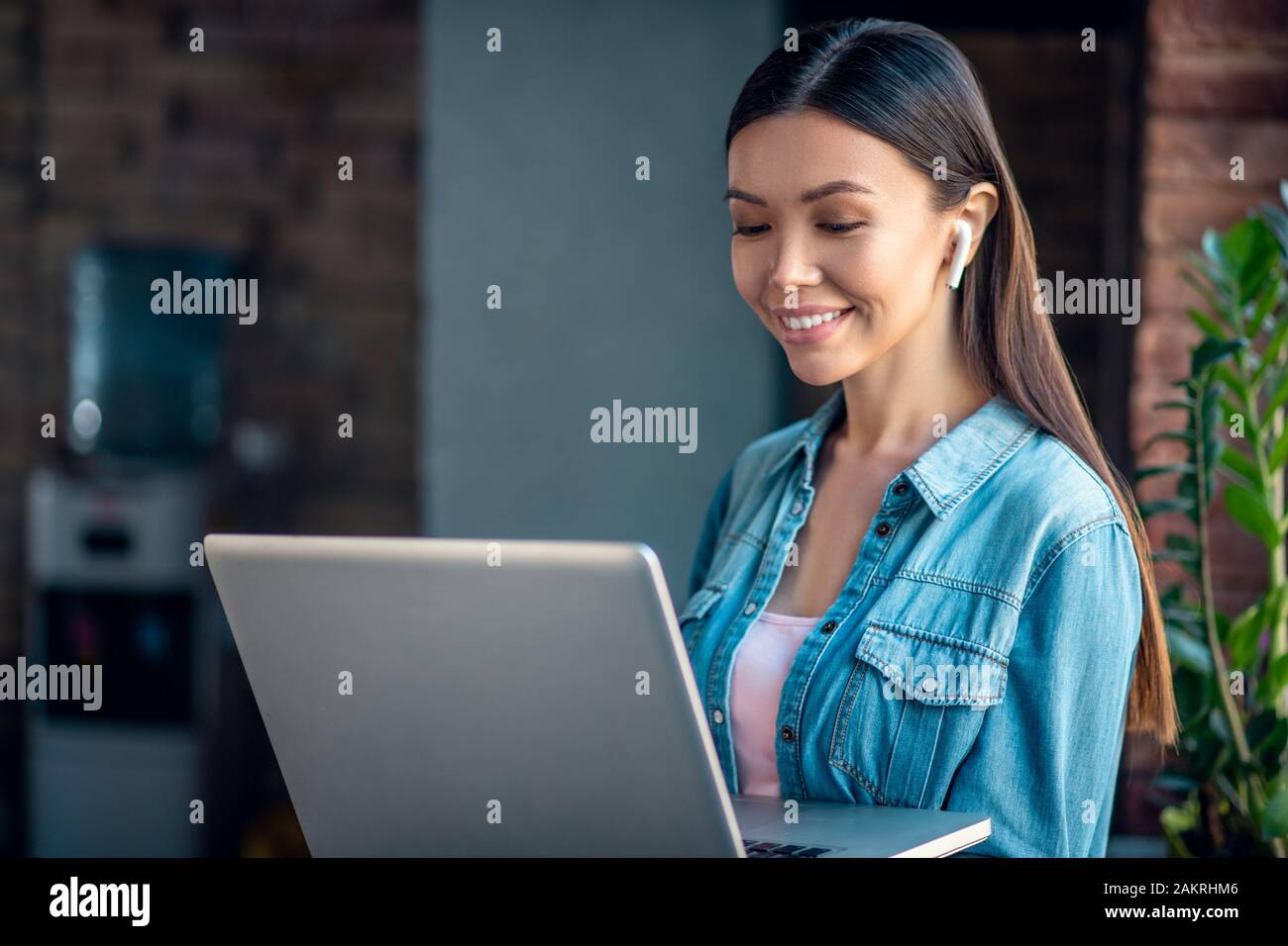 Positive delighted female working hi-res stock photography and images ...