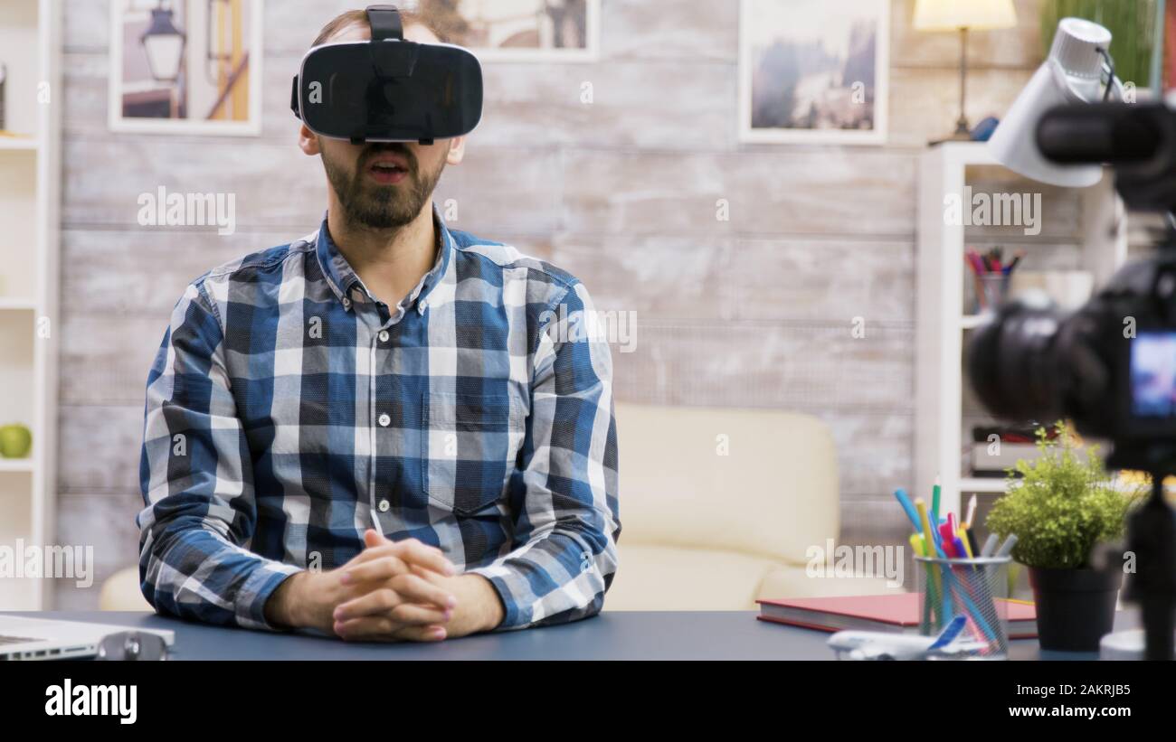 Famous influencer using virtual reality goggles while recording new ...