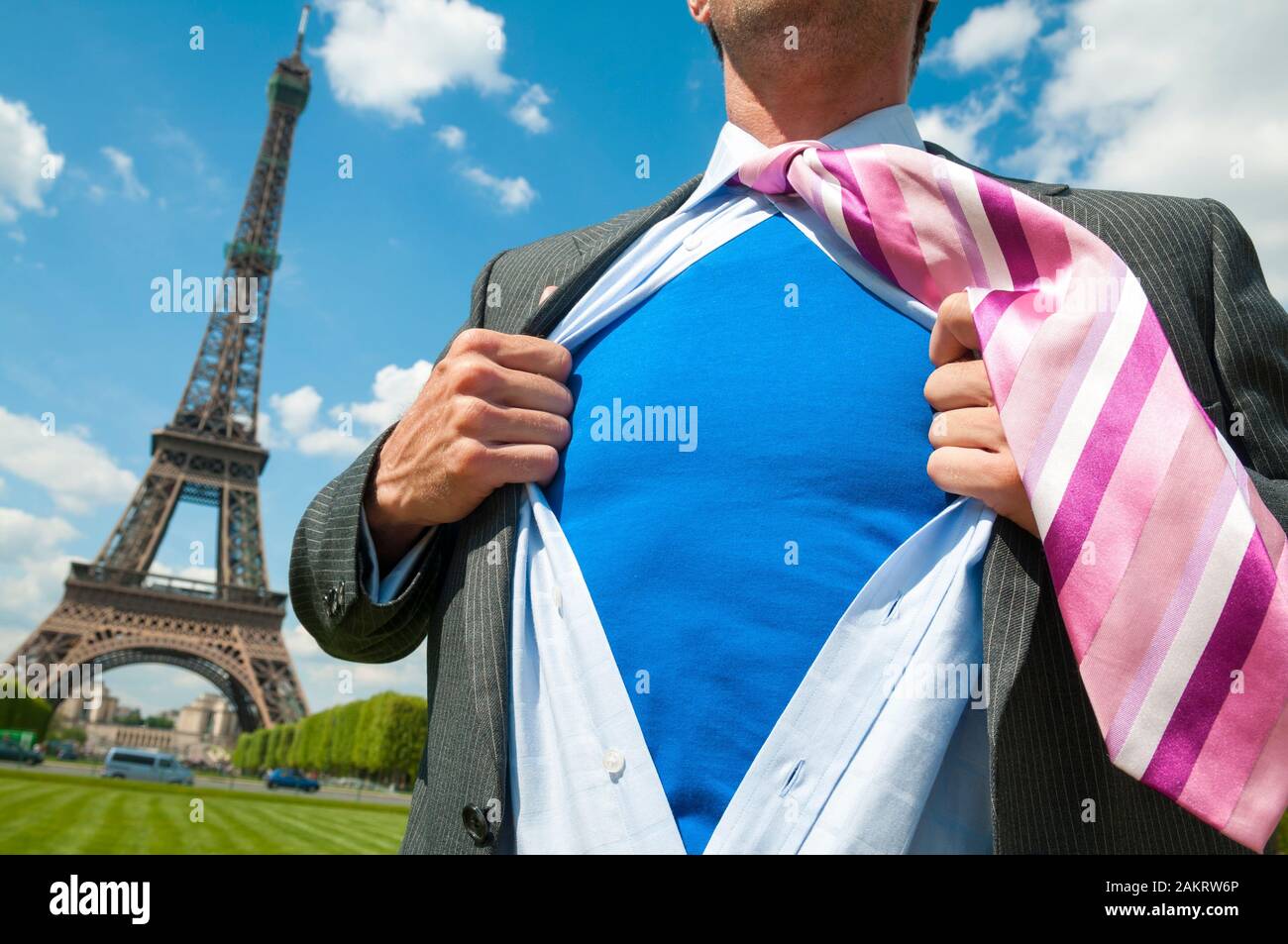 Unrecognizable European businessman ripping off his suit to reveal his ...