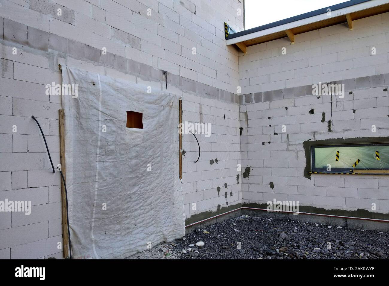 Facade of white block building under construction works Stock Photo - Alamy
