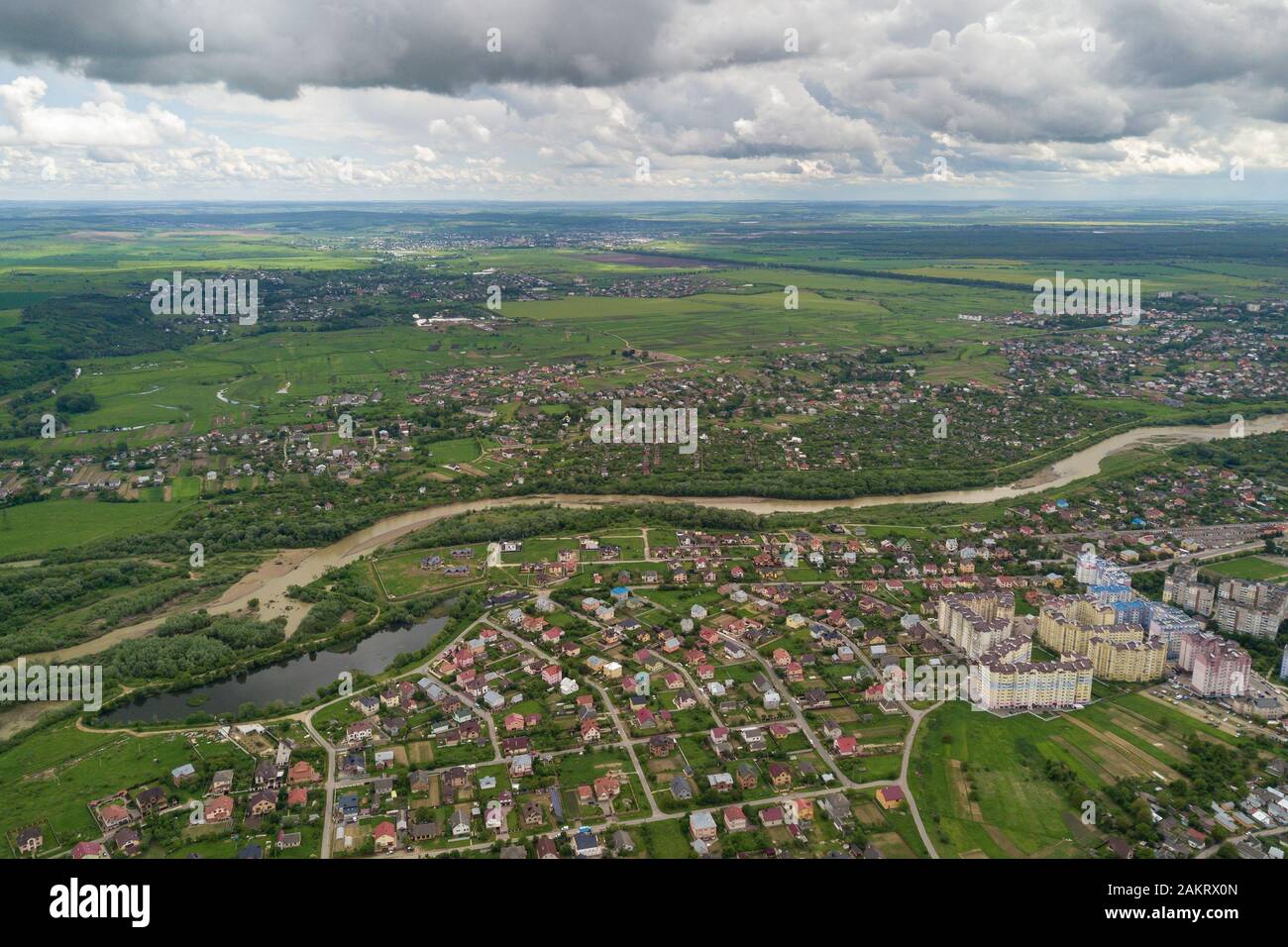 Top down aerial view of town or village with rows of buildings and ...