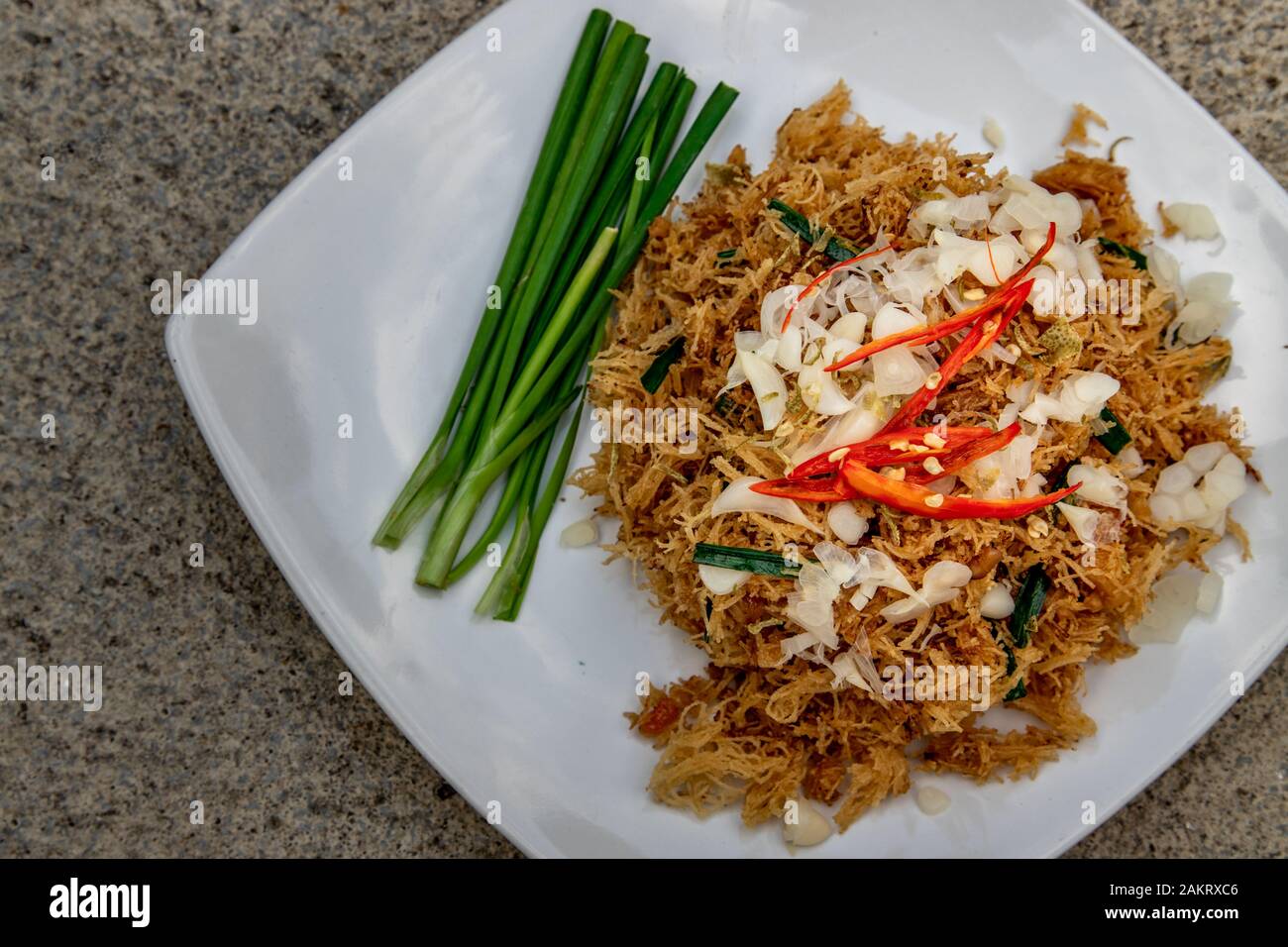 Asian eating food, Mee Grob is an sweet and sour crispy noodles, made ...