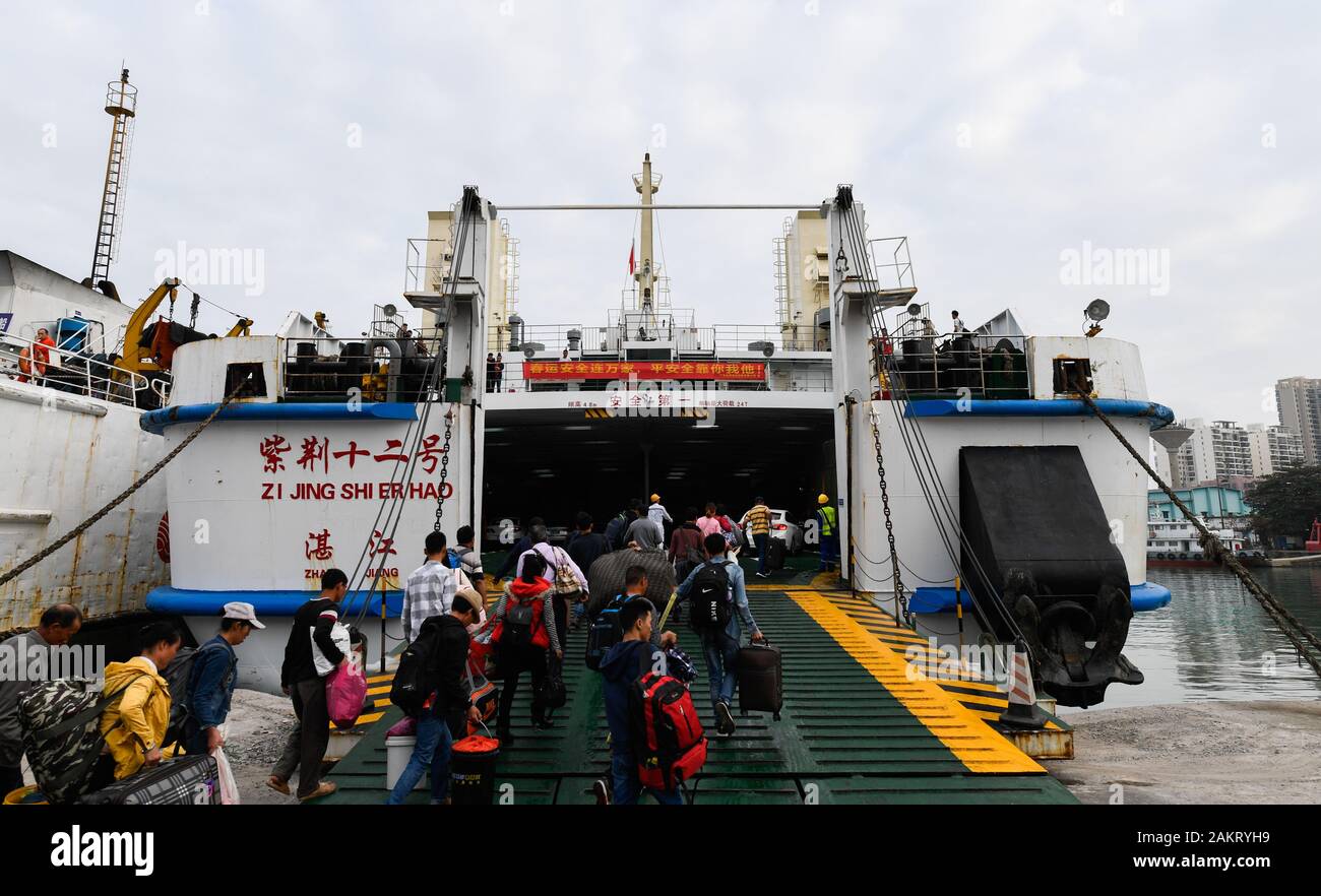 Haikou, China's Hainan Province. 10th Jan, 2020. Passengers board a ...