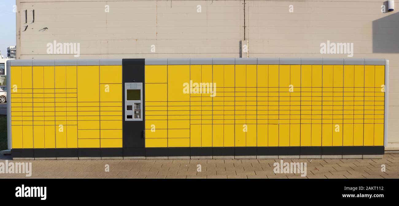 Self service very long yellow modern standard city parcel terminal ...