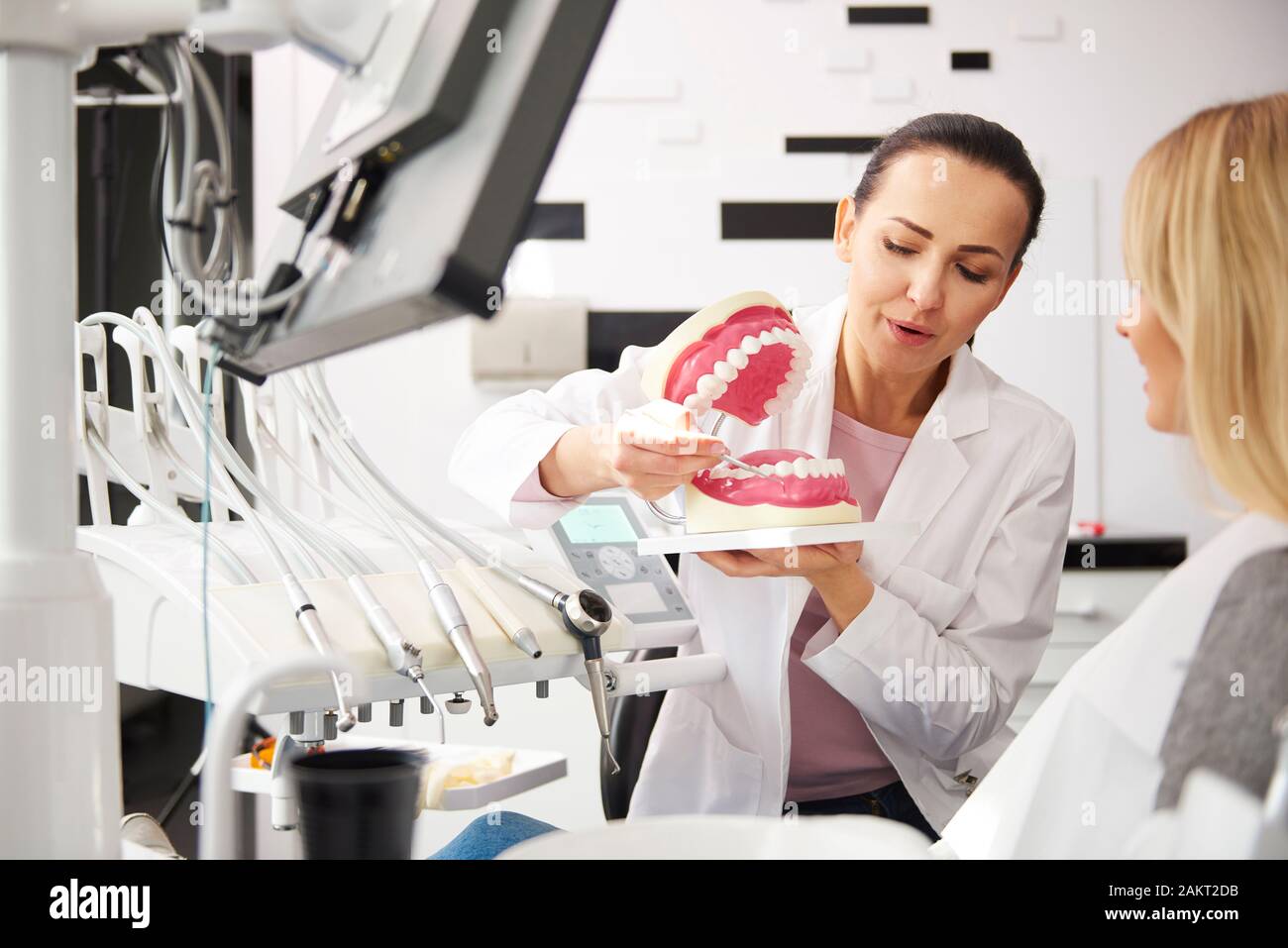 Dentist patient having conversation in hi-res stock photography and ...