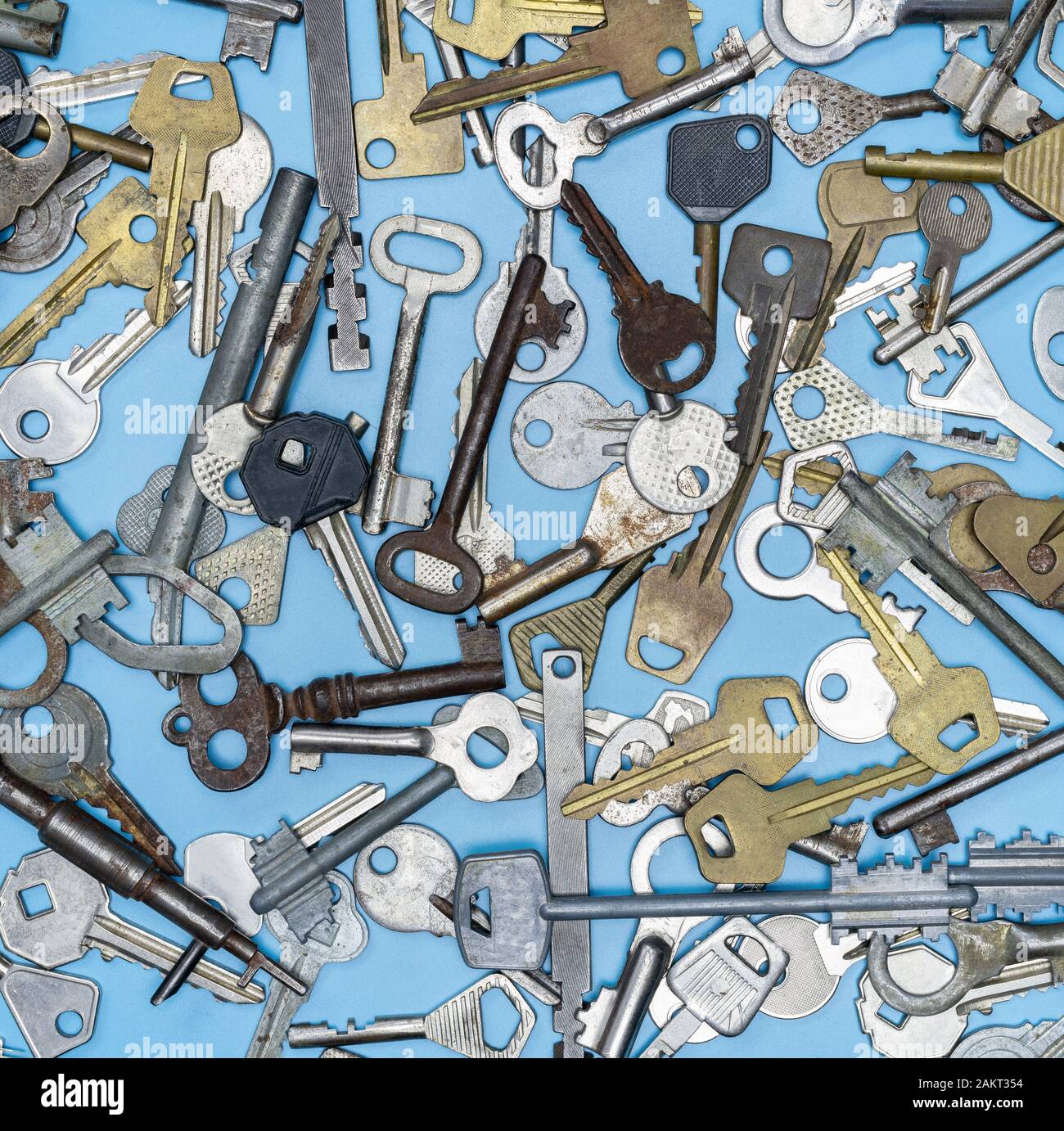 Keys set on blue background. Door lock keys and safes for property ...
