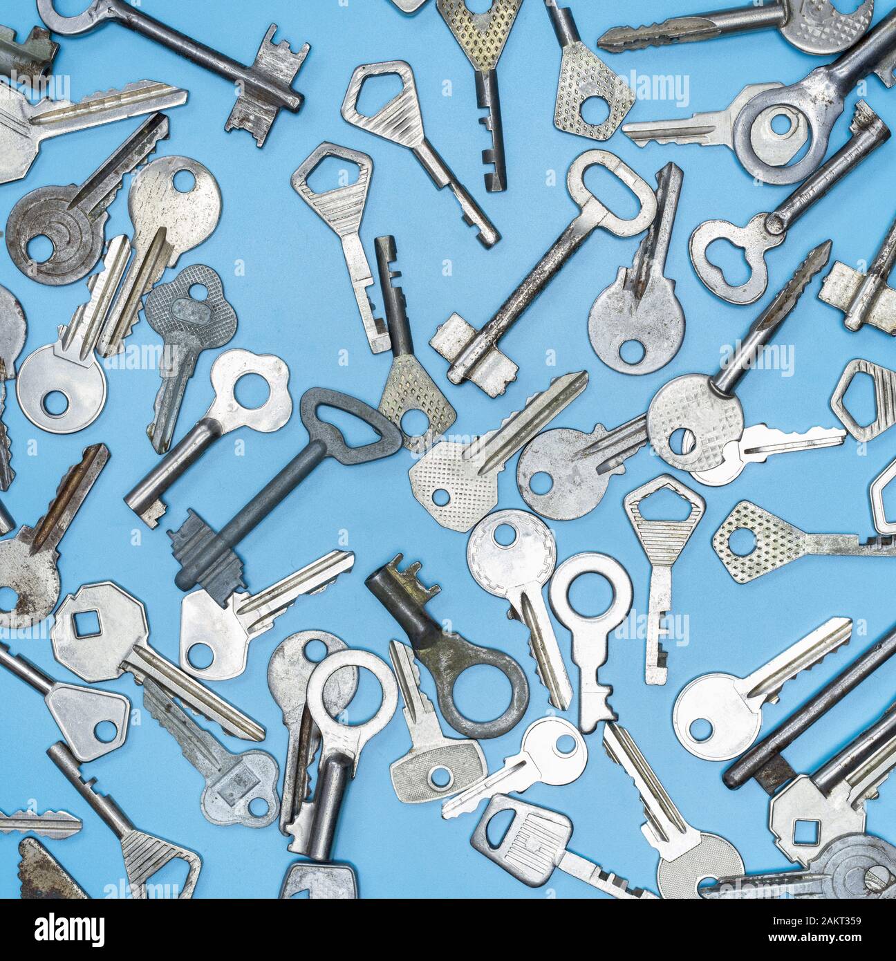 Keys set on blue background. Door lock keys and safes for property ...