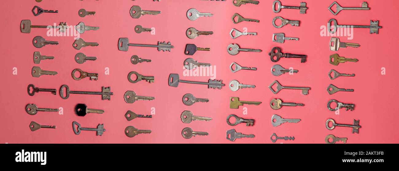 Keys set on pink background. Door lock keys and safes for property ...