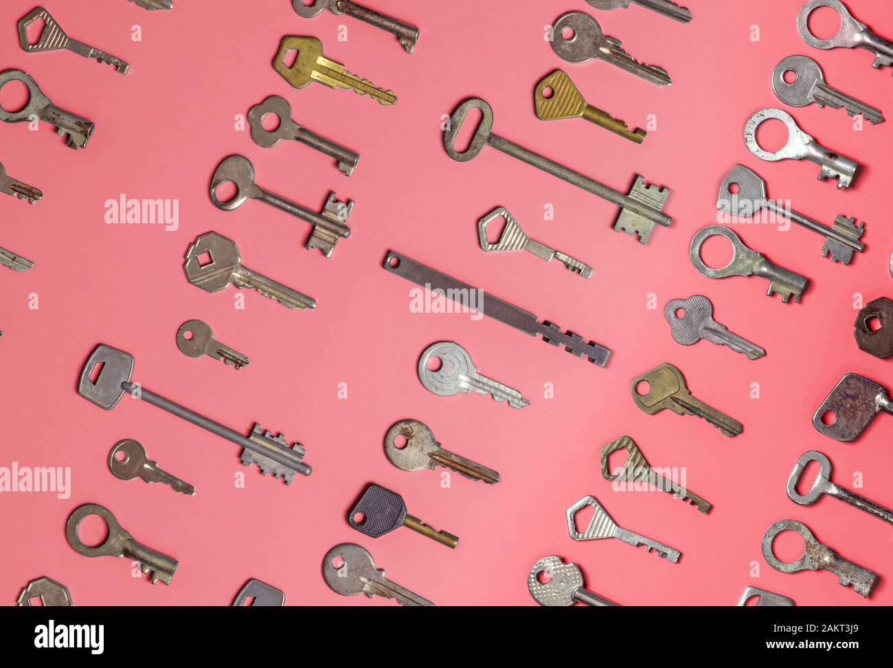 Keys set on pink background. Door lock keys and safes for property ...