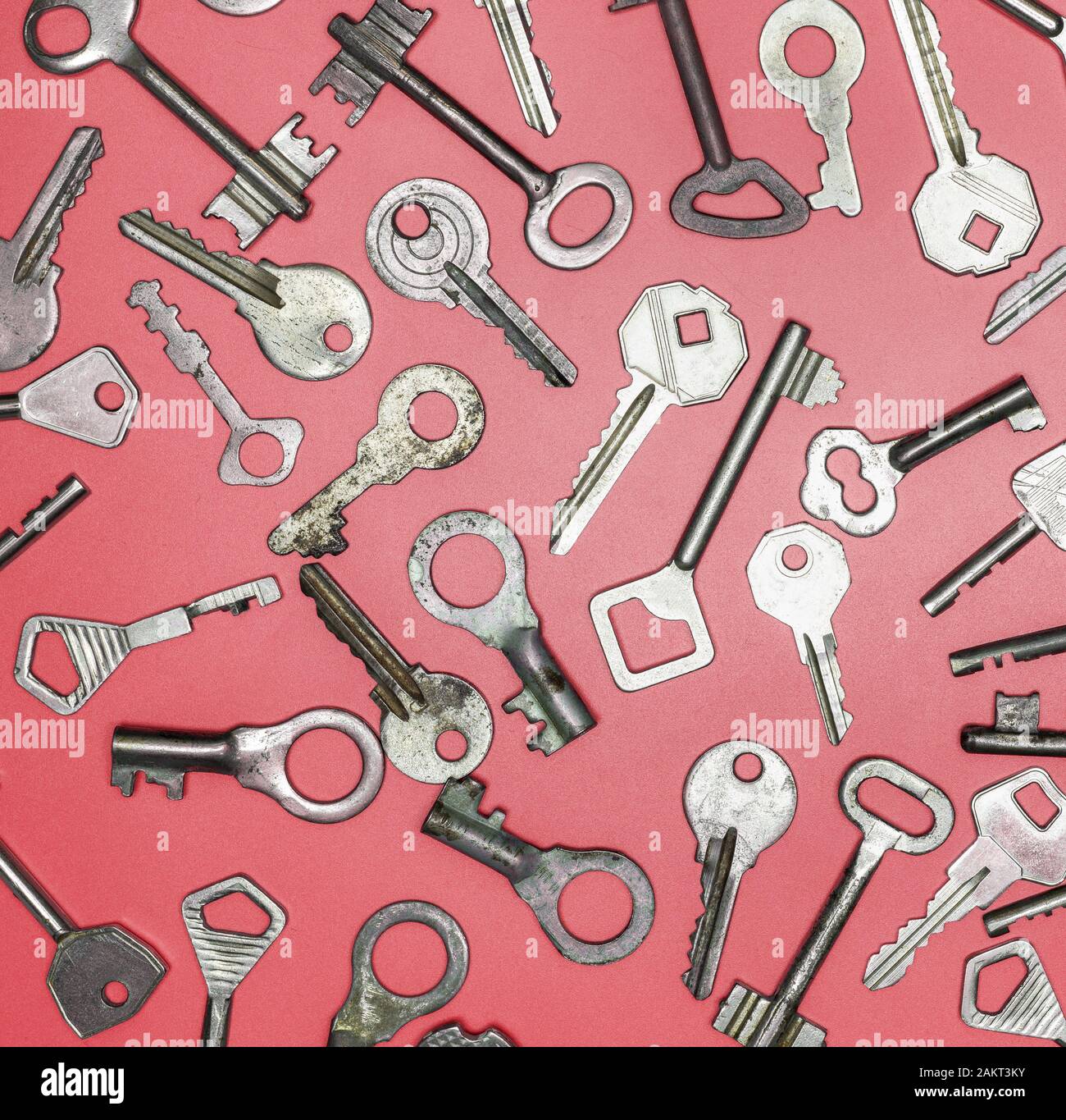 Keys set on pink background. Door lock keys and safes for property ...
