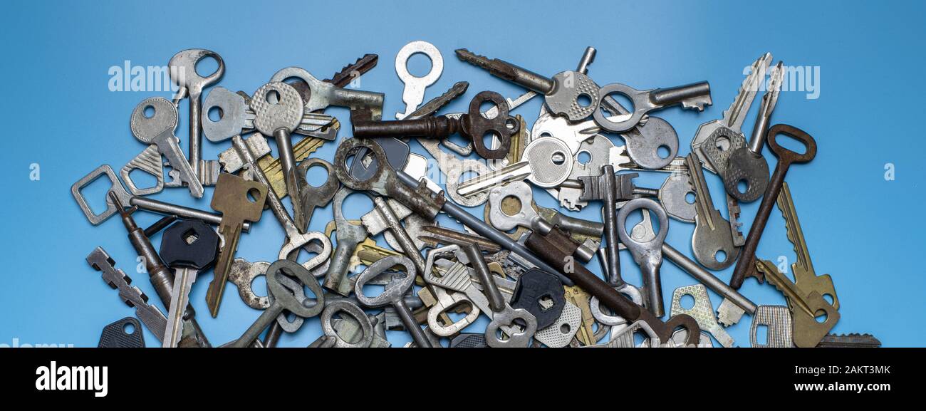 Keys set on blue background. Door lock keys and safes for property ...