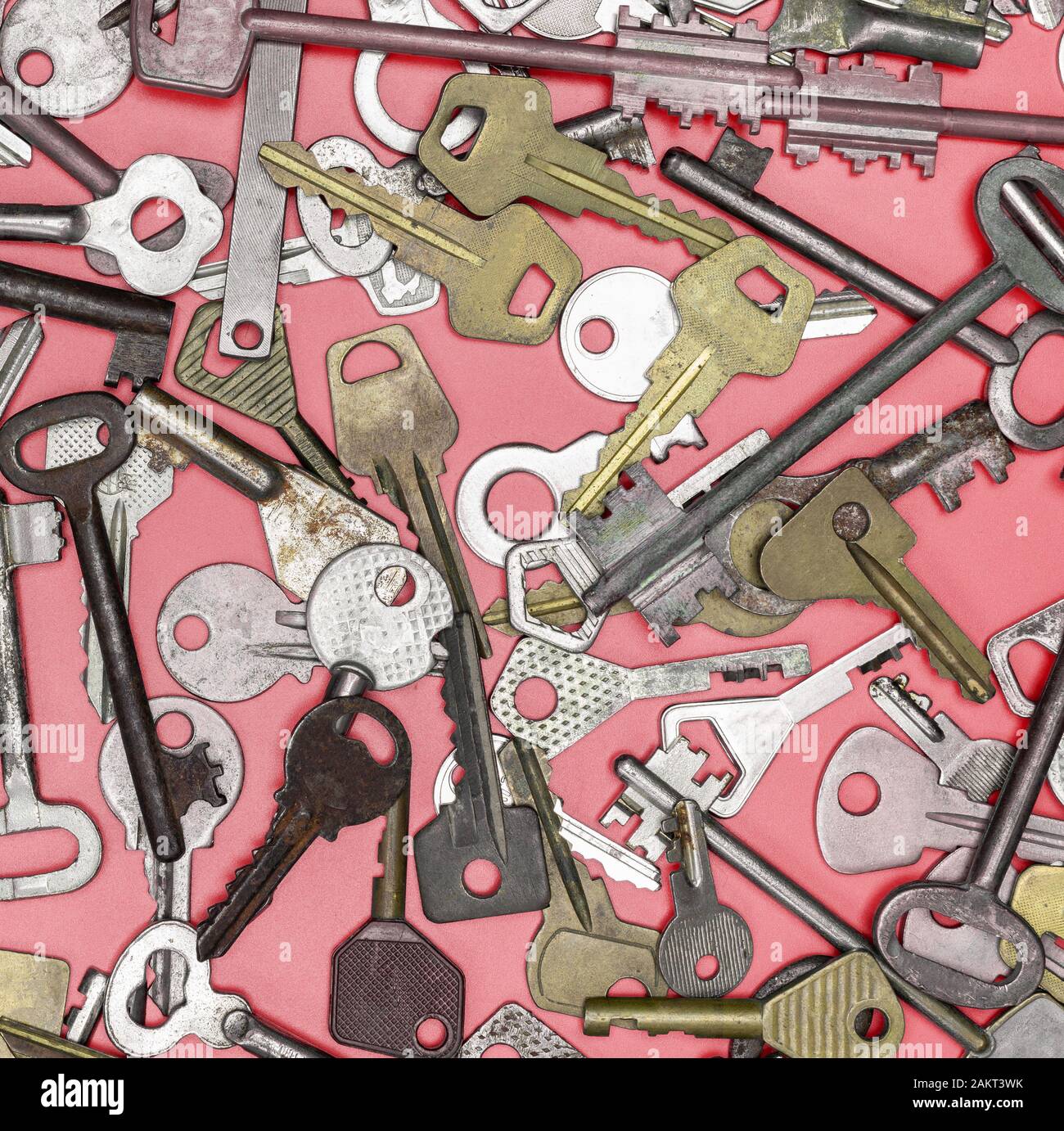 Keys set on pink background. Door lock keys and safes for property ...