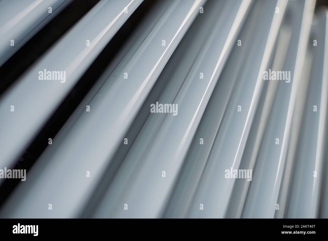 Heating radiator in office, close up. White heat exchangers. Iron ...